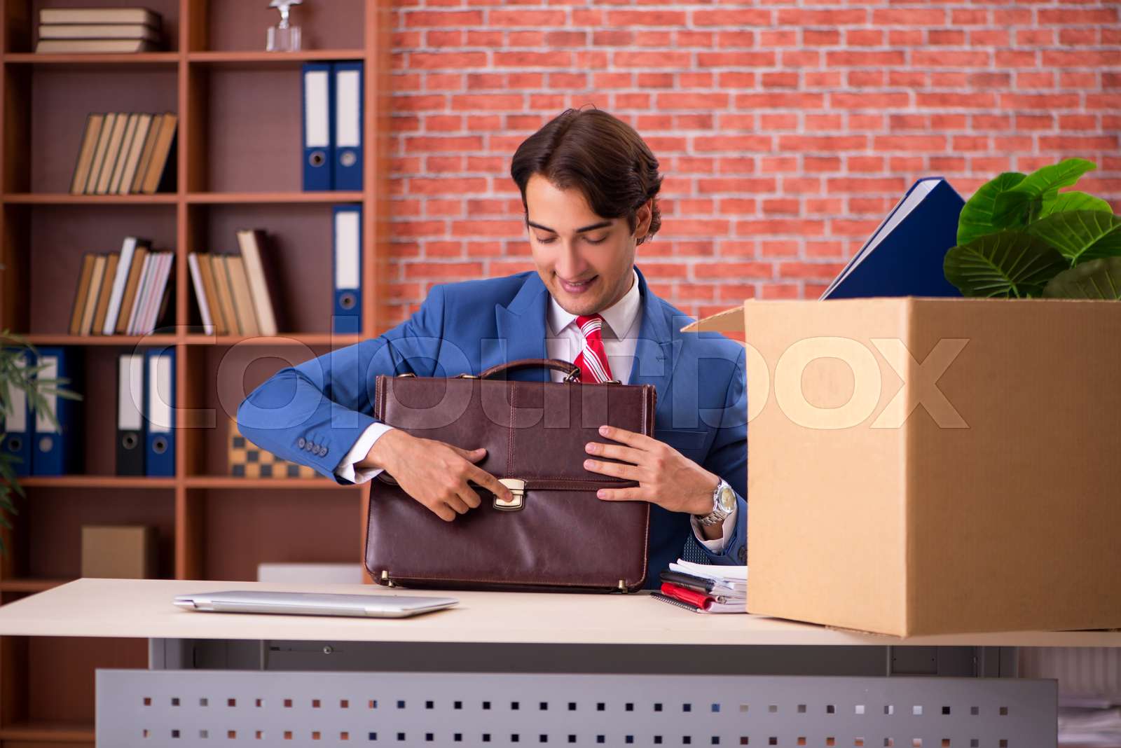 Successful employee getting new job position | Stock image | Colourbox