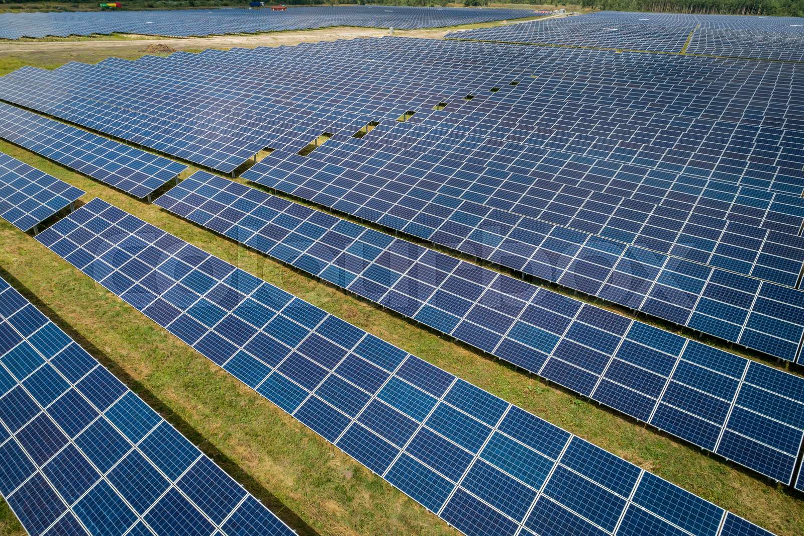 Aerial top view of a sun lit solar panels | Stock image | Colourbox