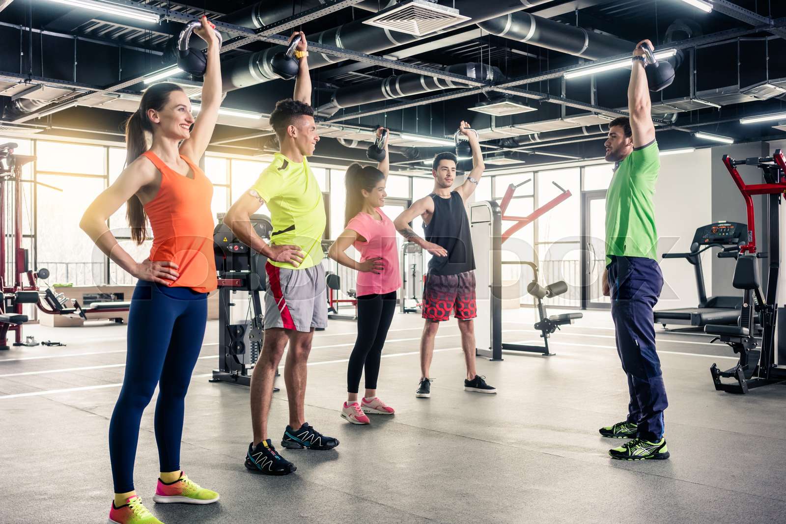 People taking training from gym trainer | Stock image | Colourbox
