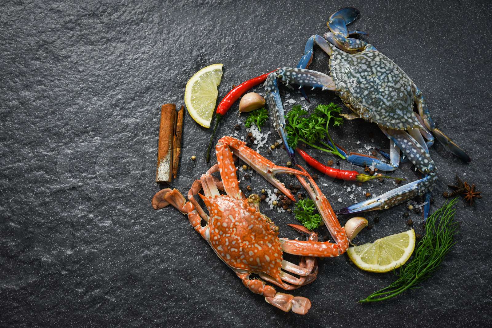 Fresh raw Crab cooked shellfish seafood and Steamed crab with herbs and ...