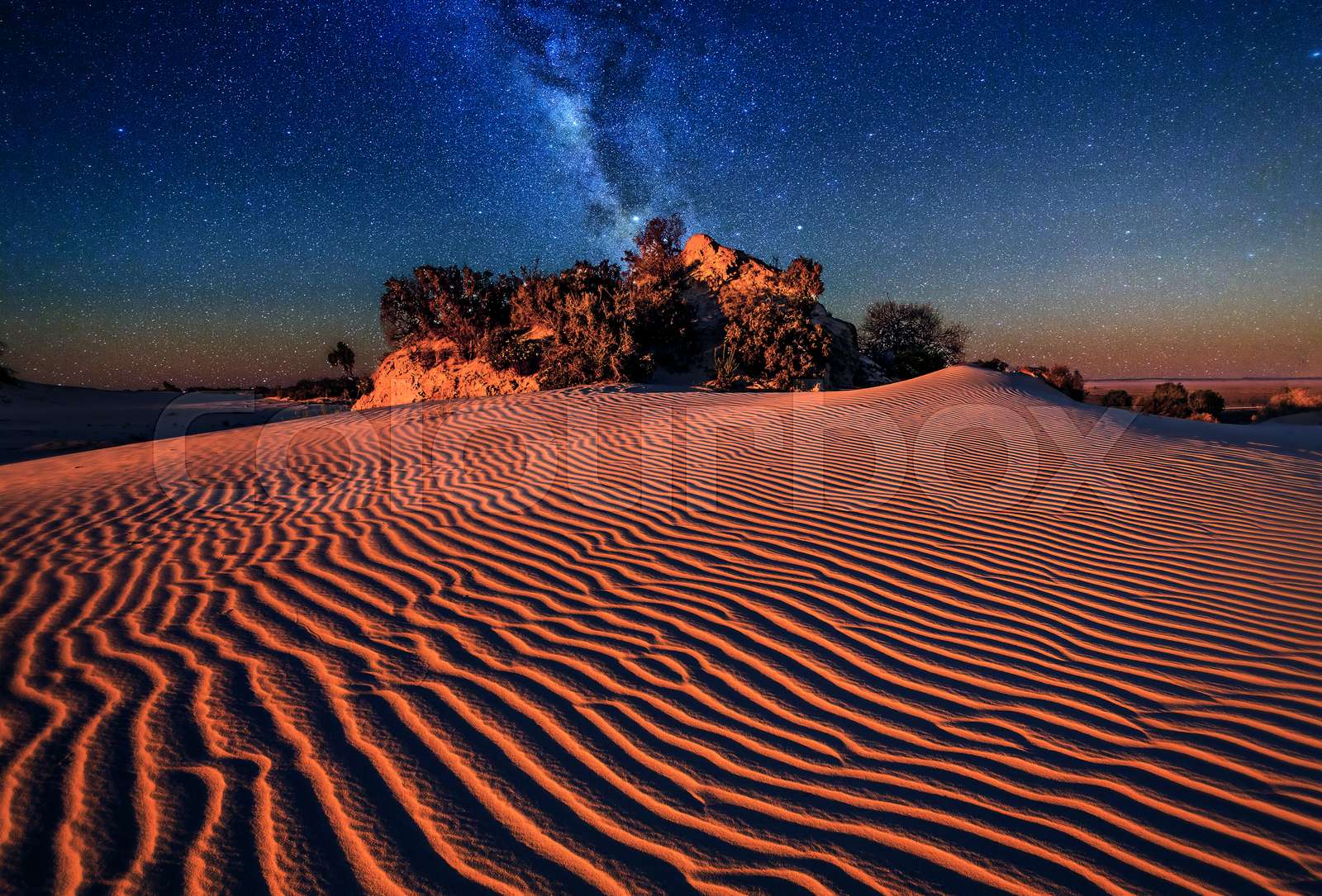 Sand dunes under starry night sky | Stock image | Colourbox