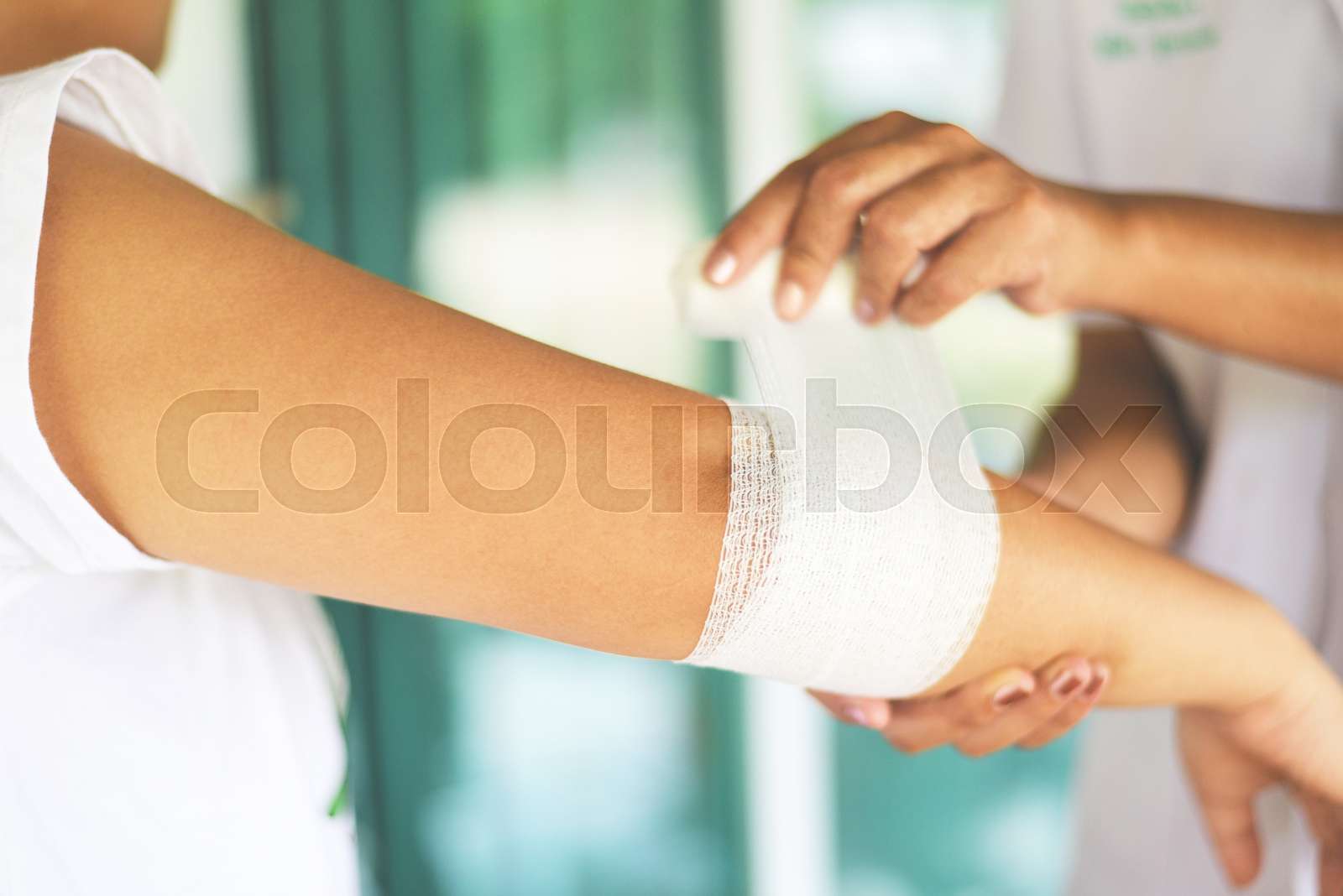 elbow wound bandaging arm by nurse - first aid wrist injury health care ...