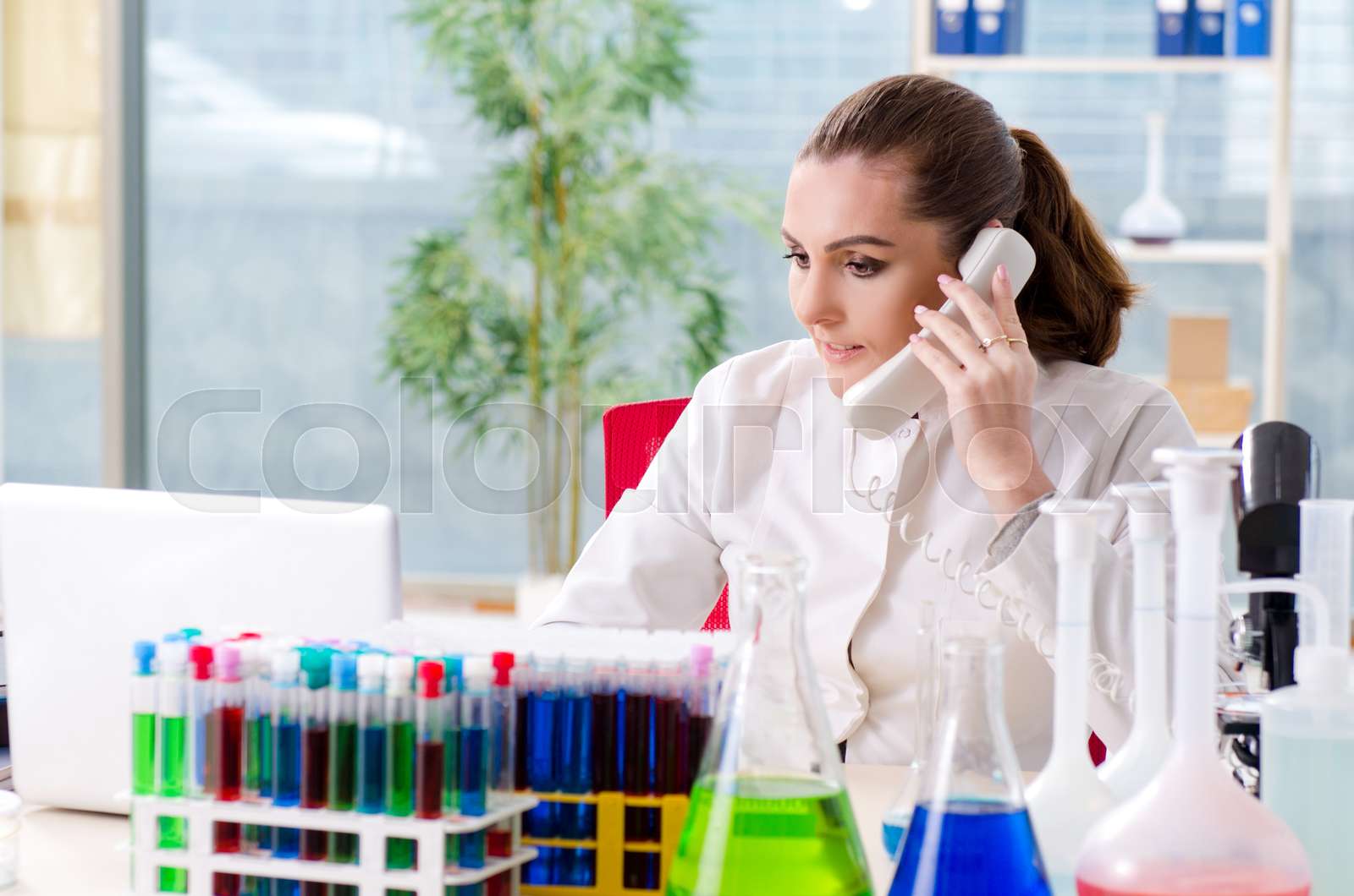 The female chemist working in medical lab | Stock image | Colourbox