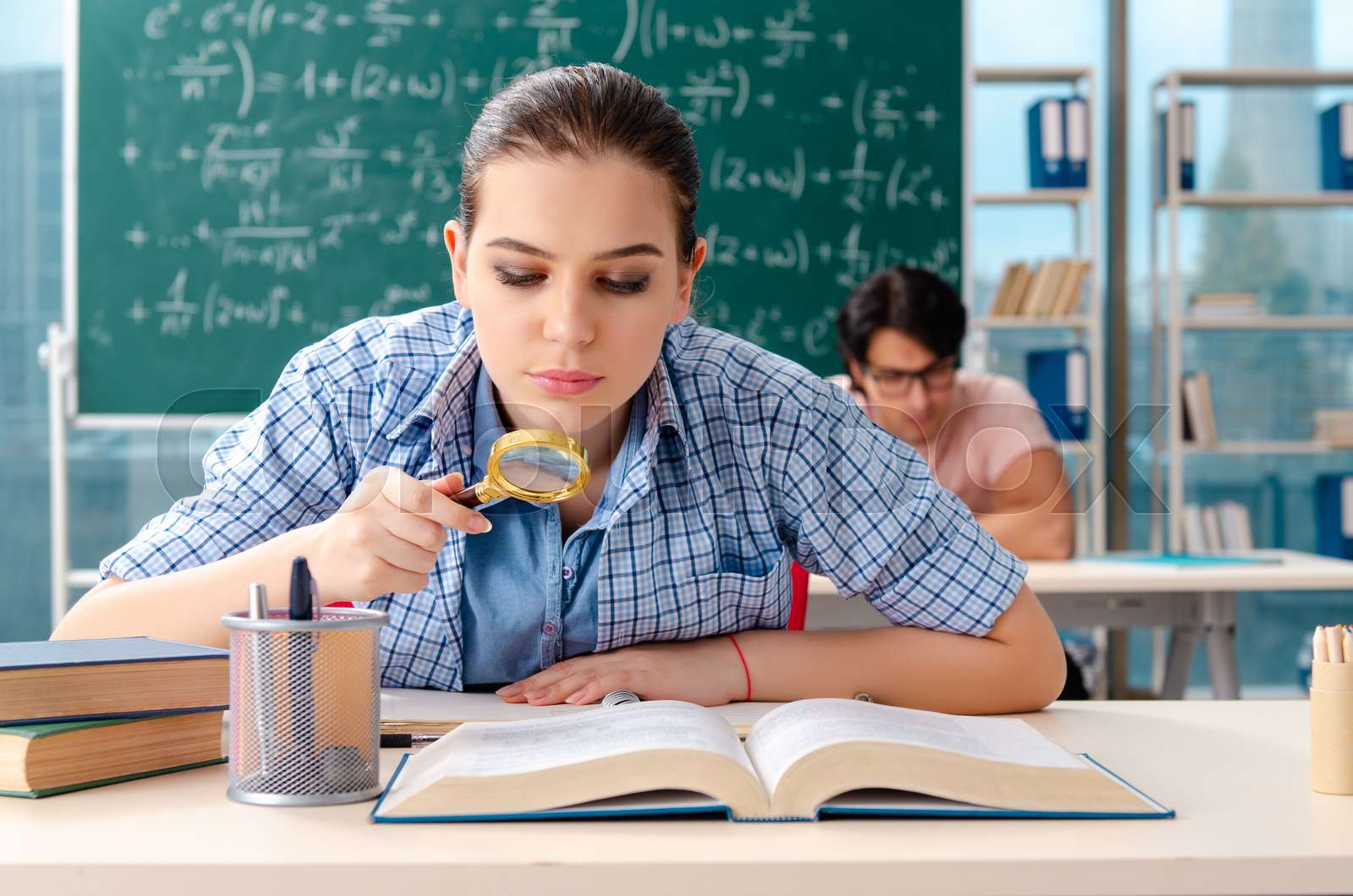 The young students taking the math exam in classroom | Stock image ...