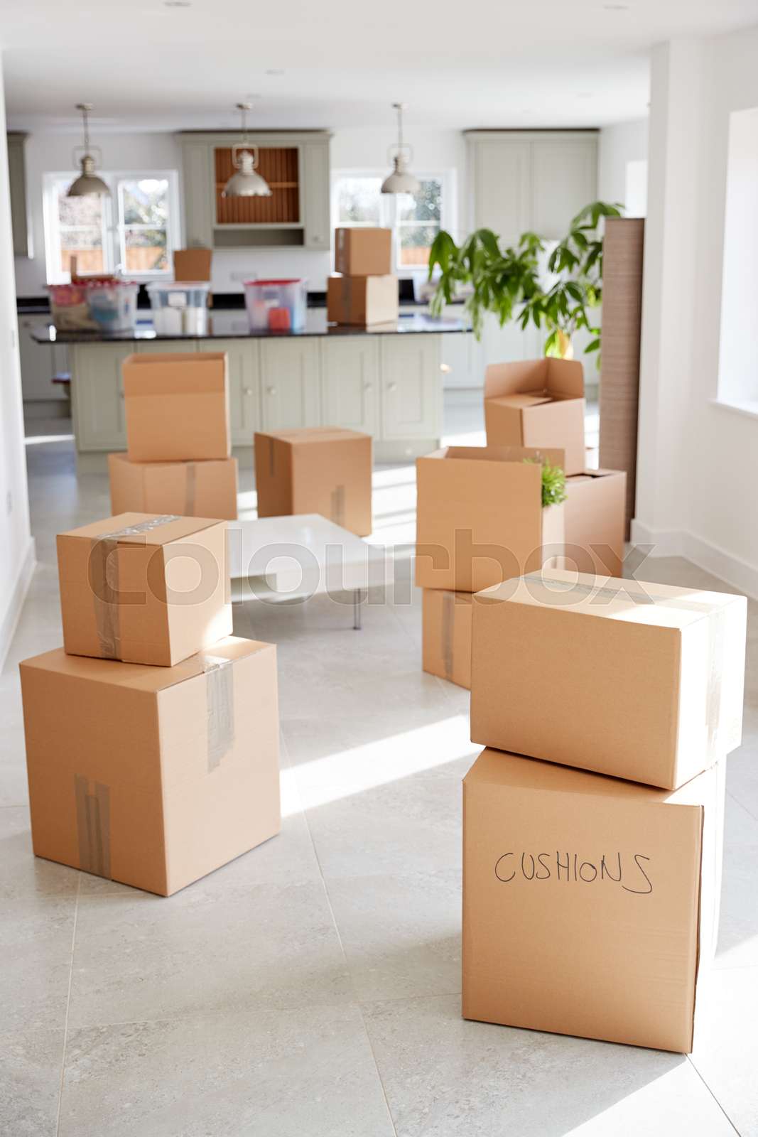 Stacked Removal Boxes In Empty Room On Moving Day | Stock image | Colourbox