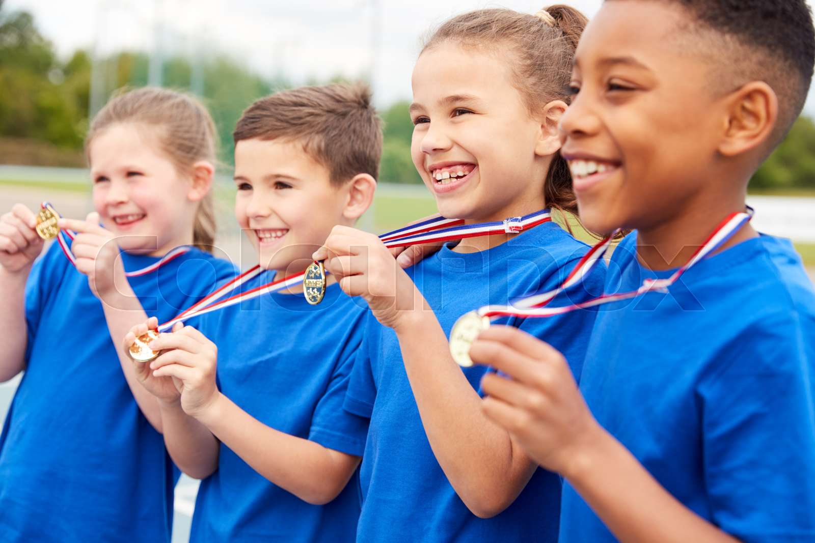 Children Showing Off Winners Medals On Sports Day | Stock image | Colourbox