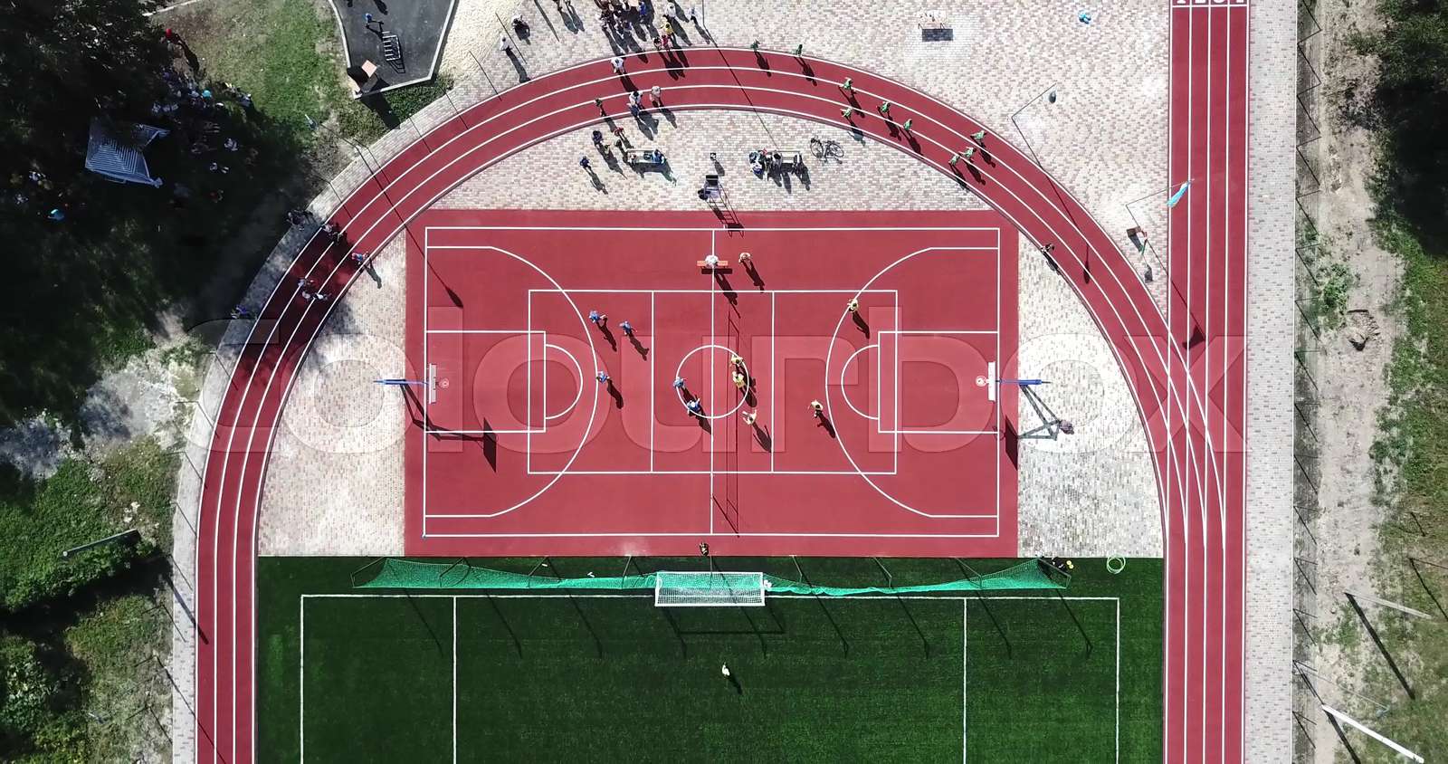 People play volleyball on a sport playground stadium from birds eye ...