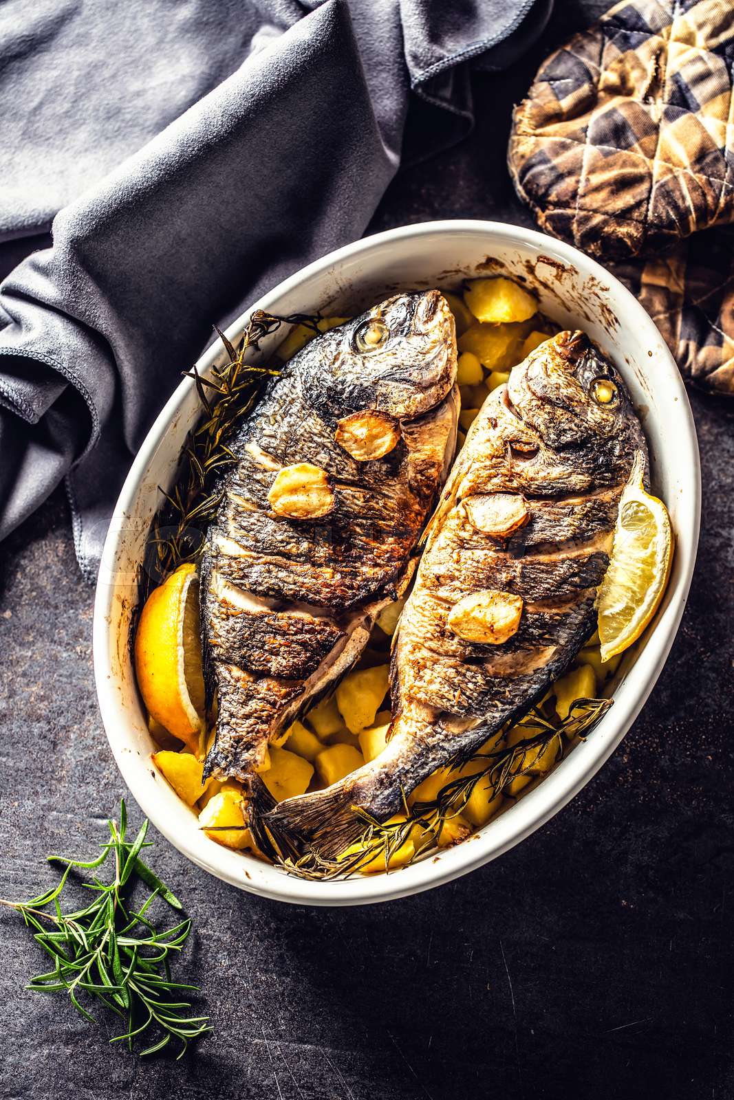 Roasted mediterranean fish bream with potatoes rosemary and lemon ...