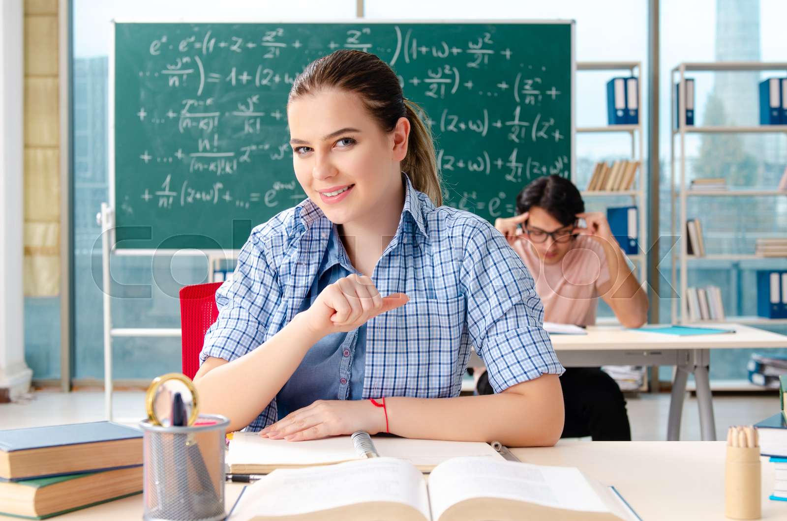 Young students taking the math exam in classroom | Stock image | Colourbox