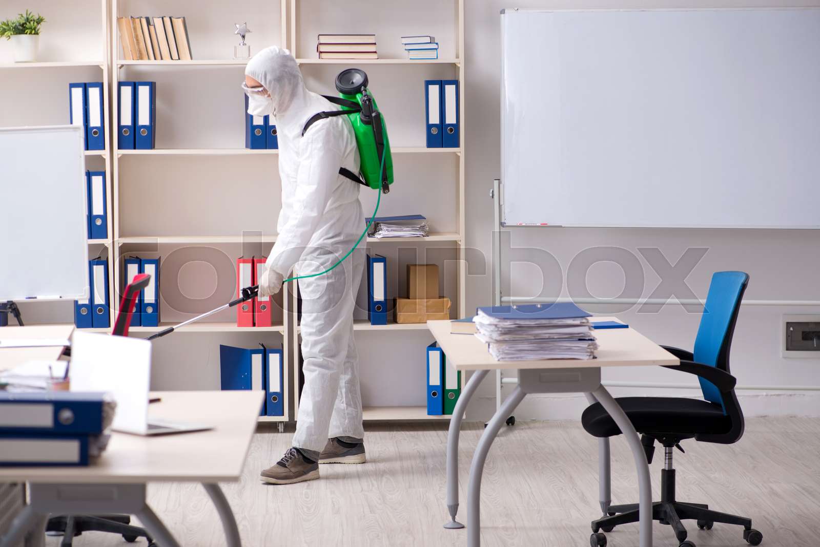 Professional contractor doing pest control at office | Stock image ...