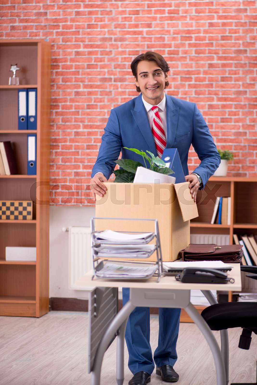 Successful employee getting new job position | Stock image | Colourbox