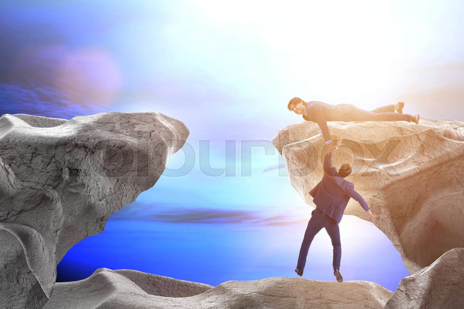 Businessman offering helping hand to falling colleague | Stock image ...