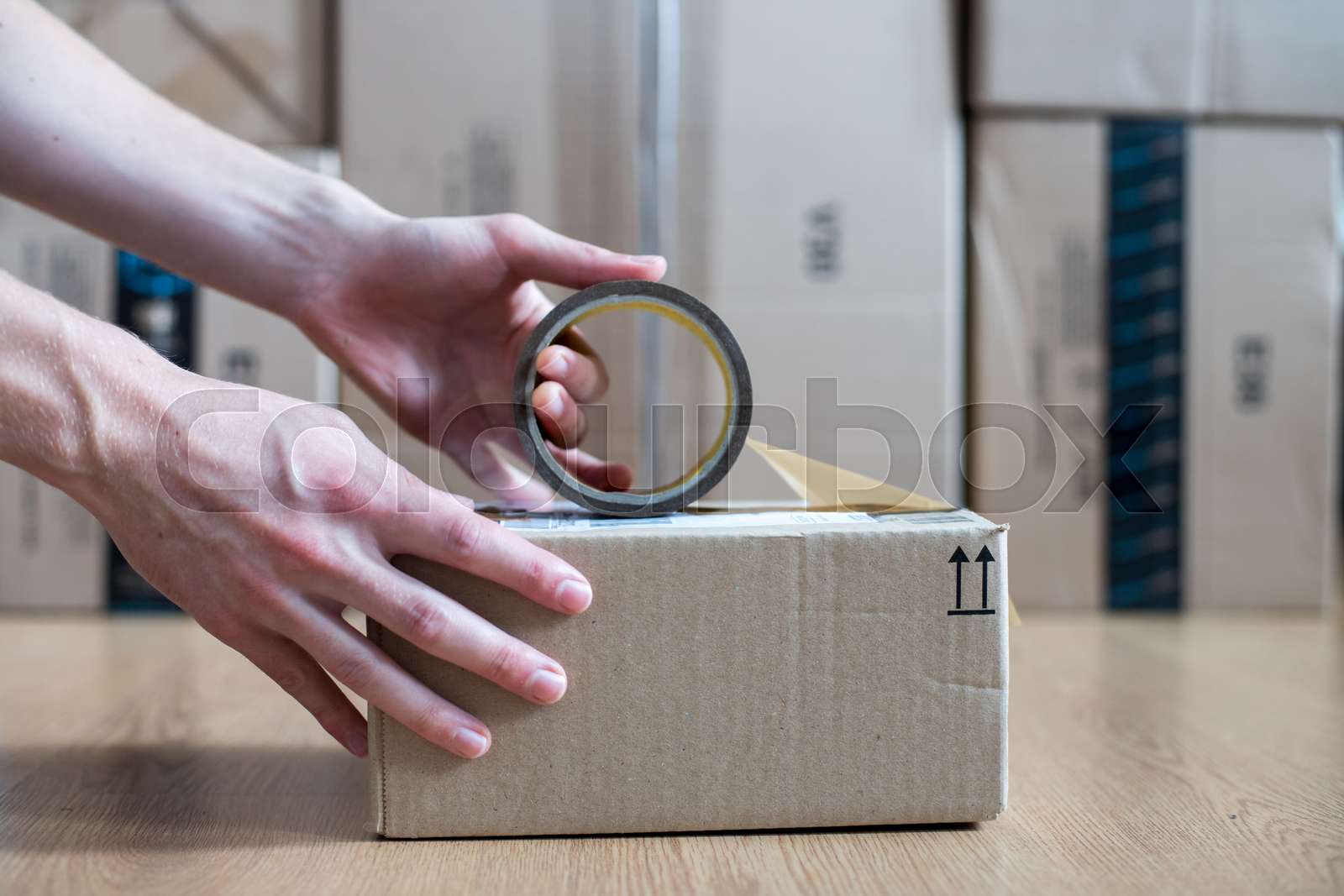 Cardboard box package, shipping concept: Preparing a parcel for ...