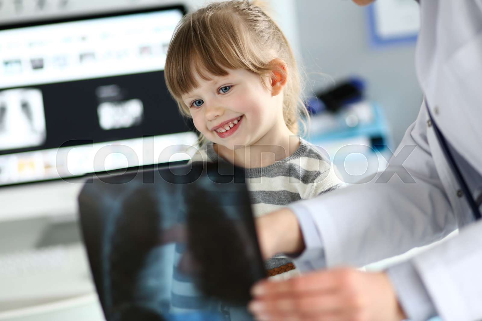 Doctor pointing at snapshot | Stock image | Colourbox