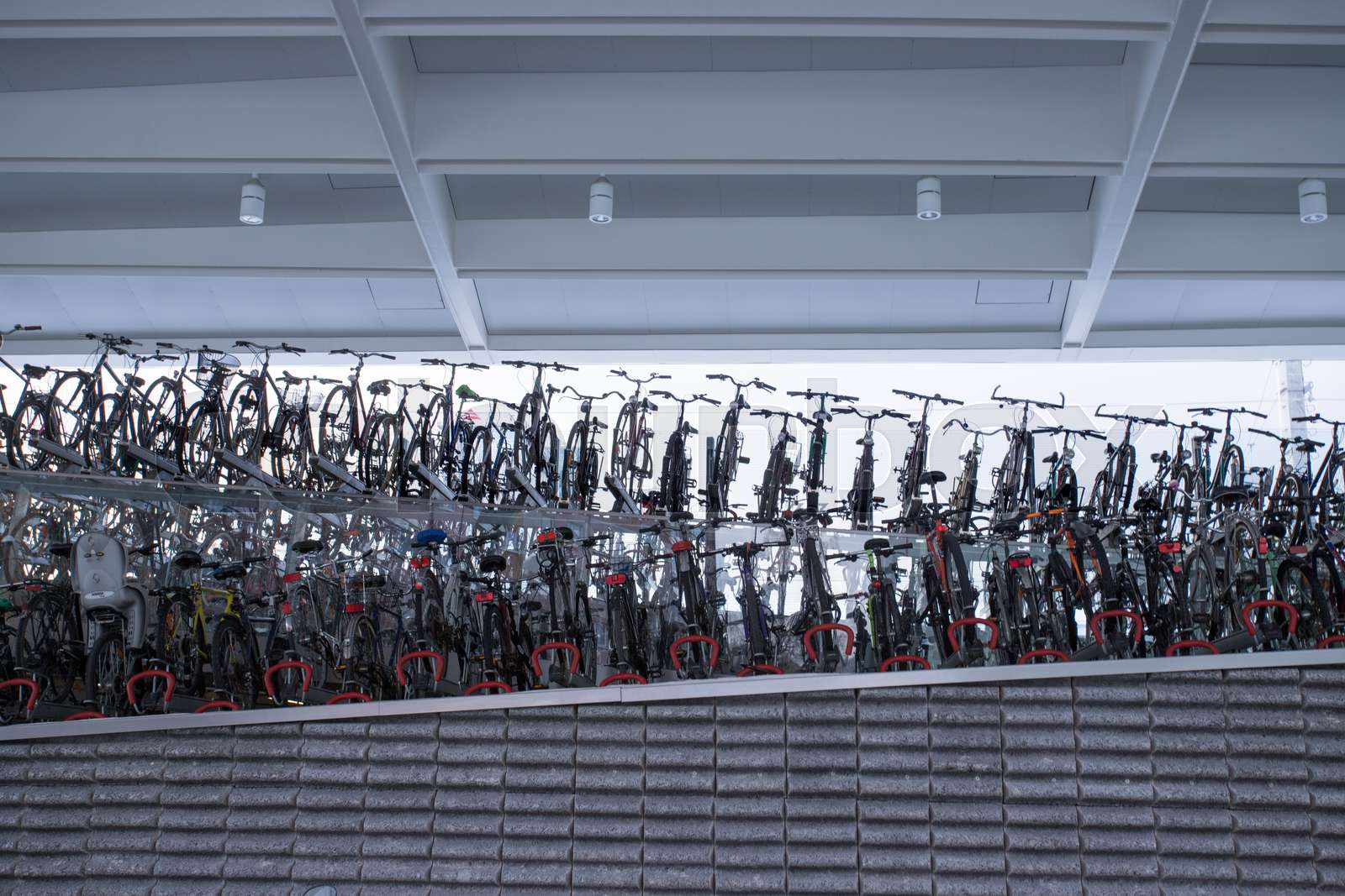 Bike rack on a train station: Stacked bikes | Stock image | Colourbox