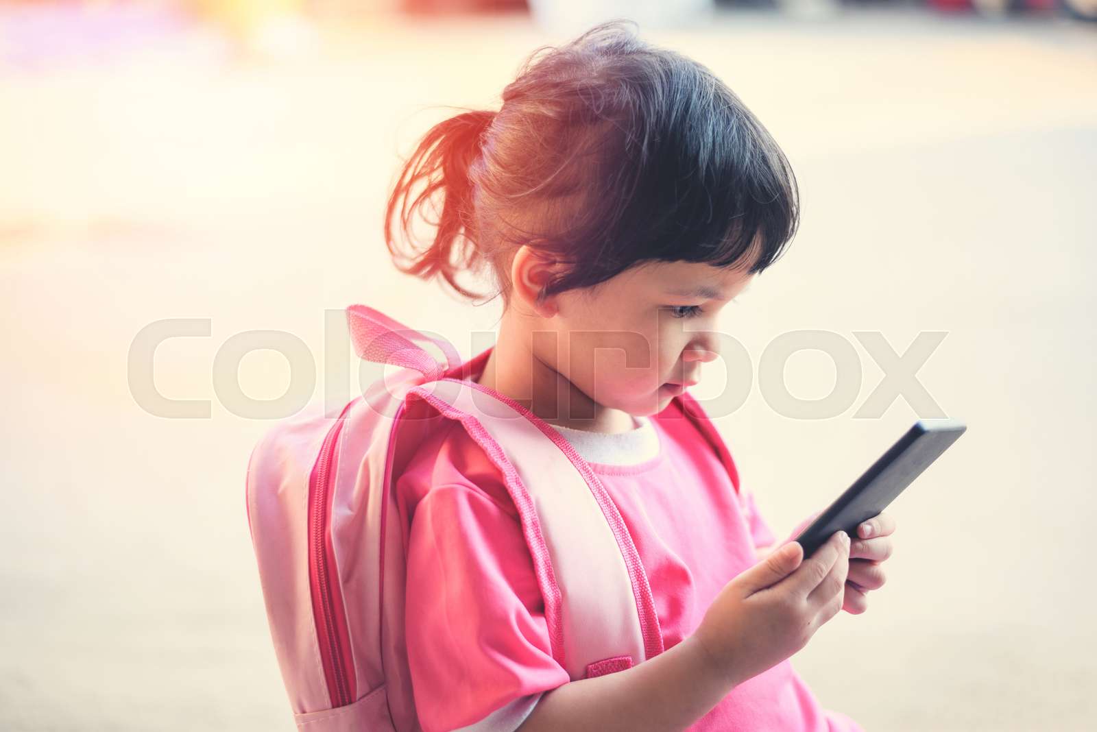 Children Playing Smartphone / child girl hold telephone in hand ...