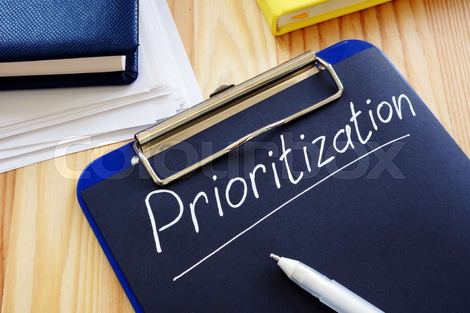 Prioritization handwritten sign on the black page. | Stock image ...
