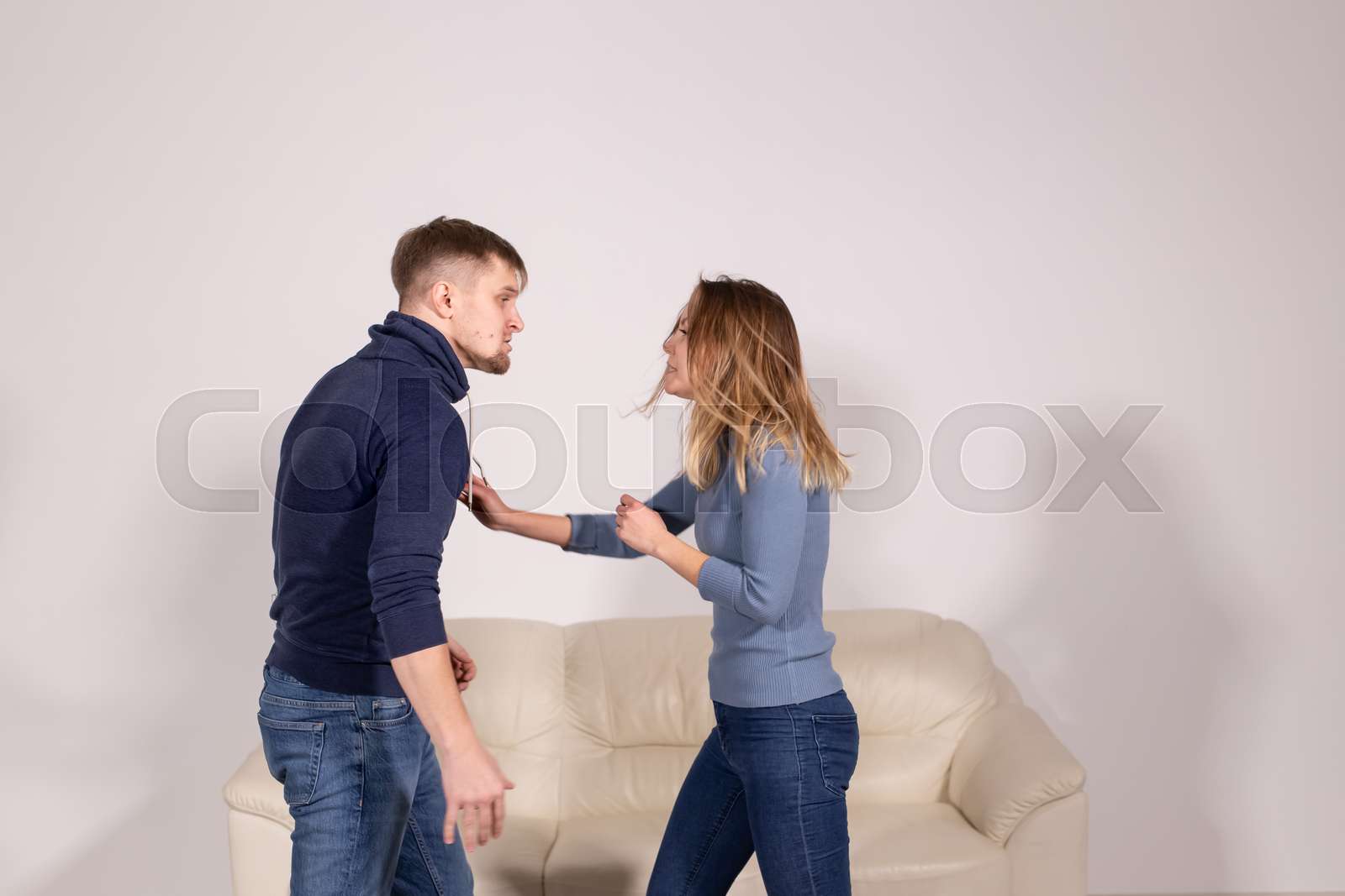people, violence and abuse concept - young aggressive man hitting his ...