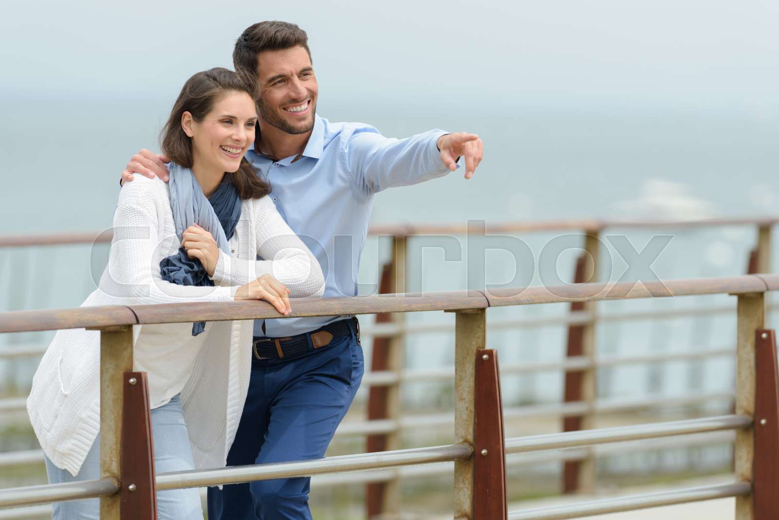 couple pointing in a pier | Stock image | Colourbox