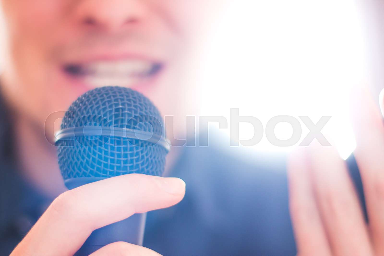 Press officer is speaking into a microphone and giving an interview ...