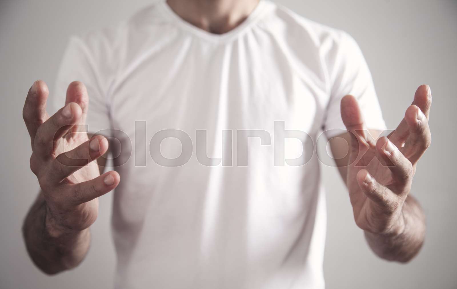 Man hands with protect gesture. | Stock image | Colourbox