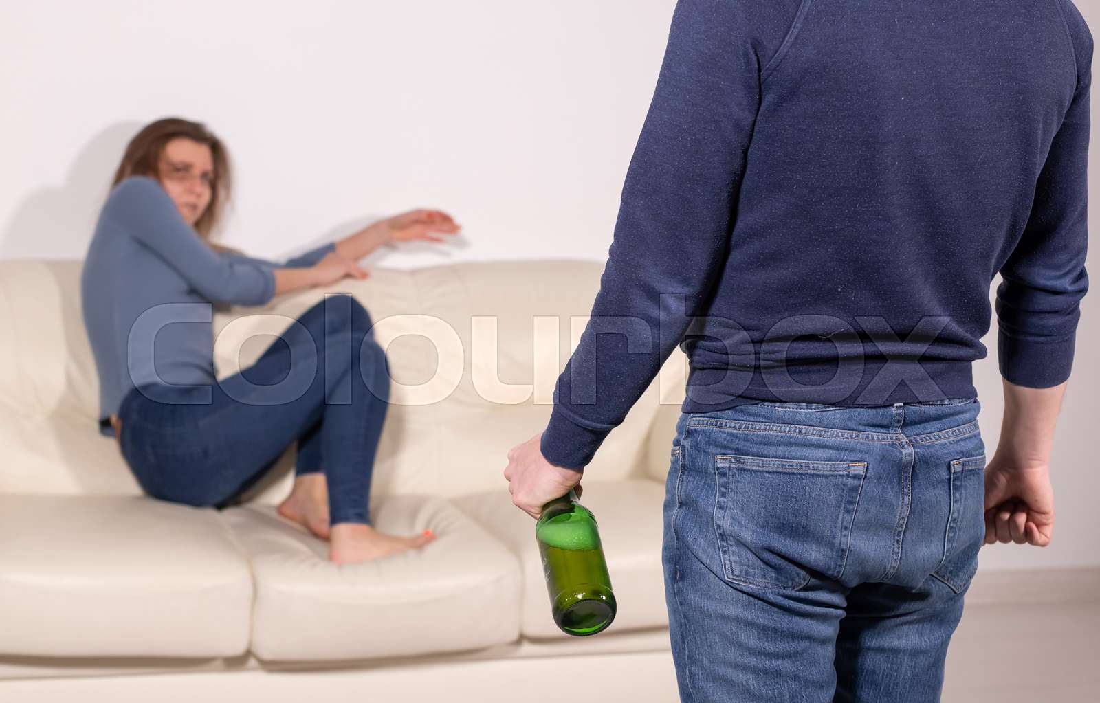 alcoholic, domestic violence and abuse concept - man gets drunk at home ...
