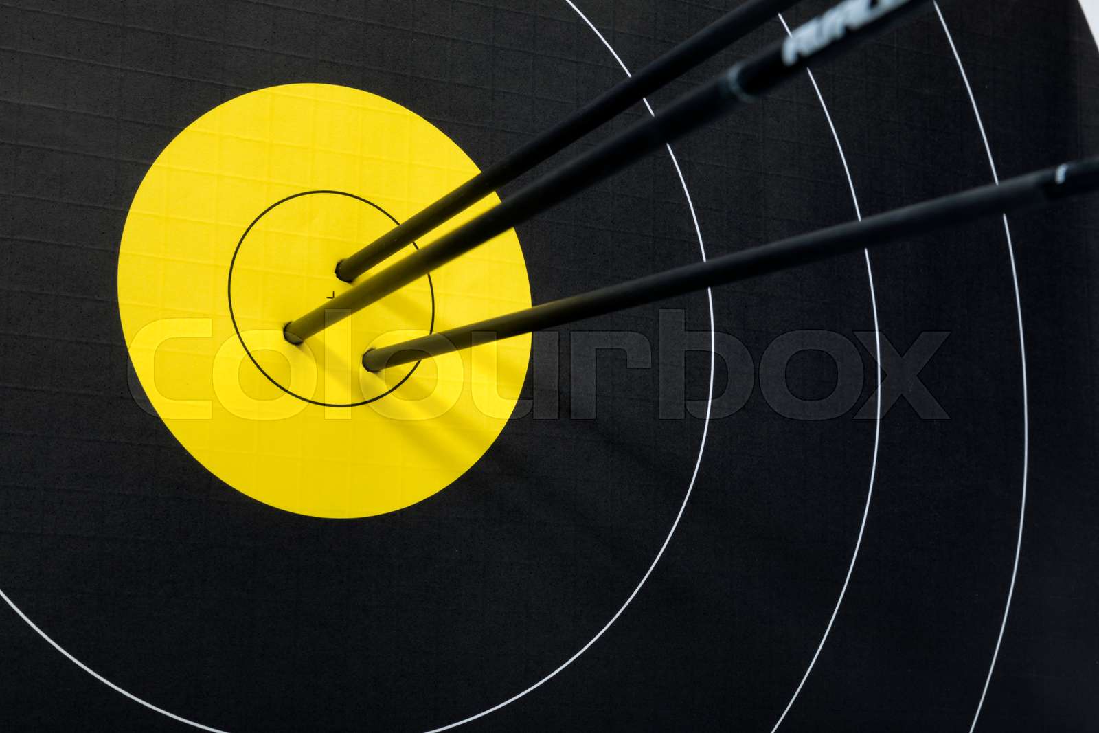 Arrows in center of archery target | Stock image | Colourbox