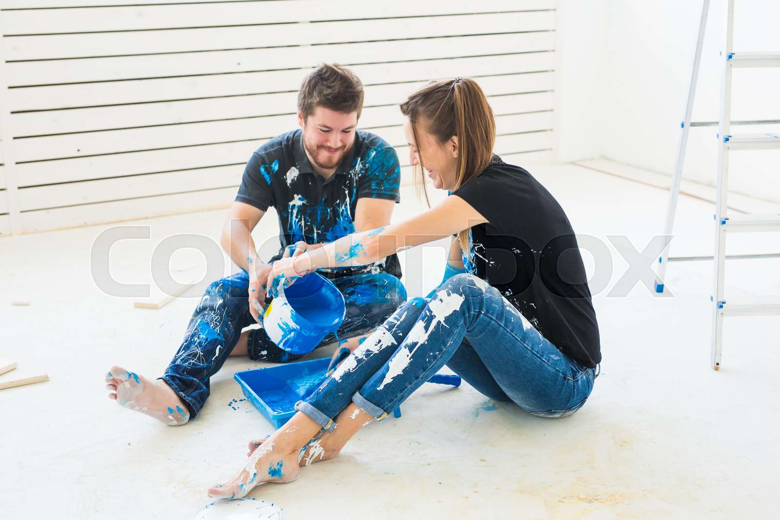 People, renovation and repair concept - portrait of happy couple pour ...