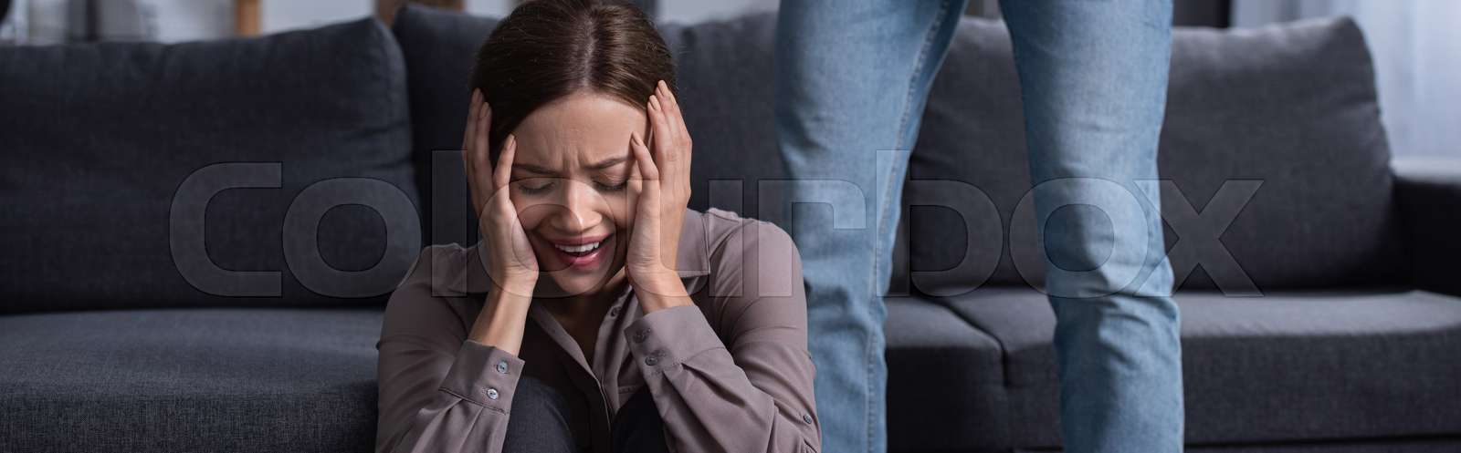 panoramic shot of man and scared crying wife at home | Stock image ...