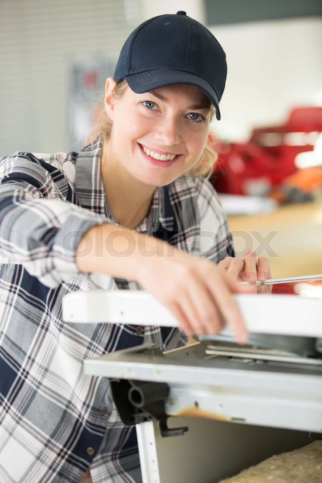 a smiling female handyman working | Stock image | Colourbox