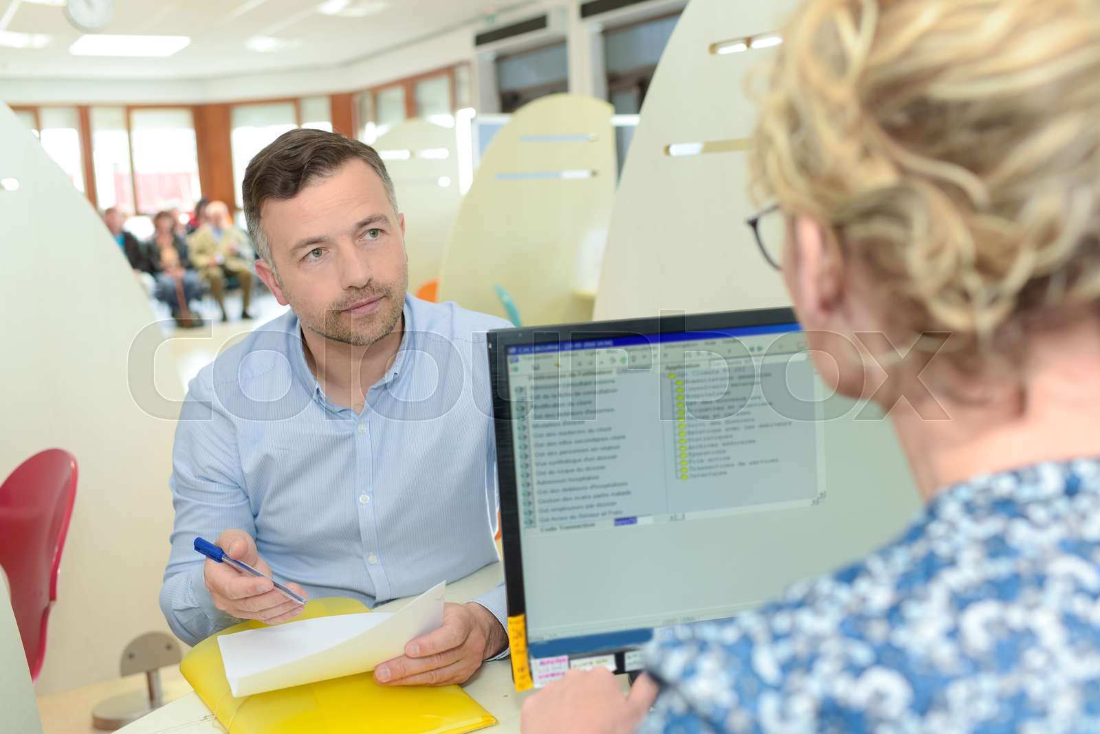 public worker receptionist giving instruction to the customer | Stock ...