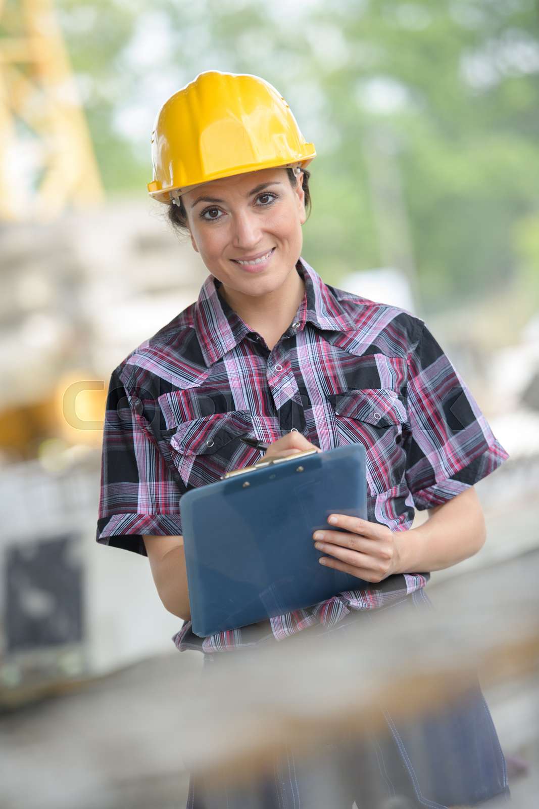 female builder with a clipboard | Stock image | Colourbox