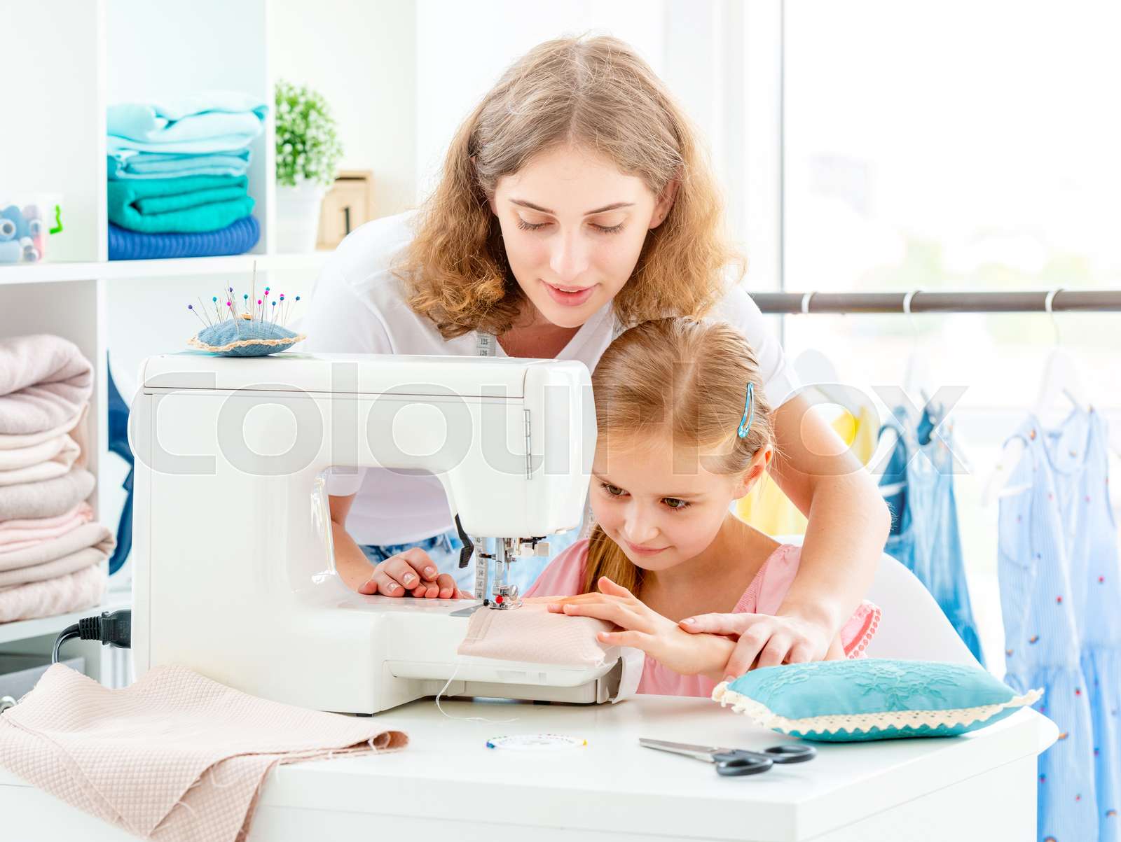 Mother and daughter sewing | Stock image | Colourbox