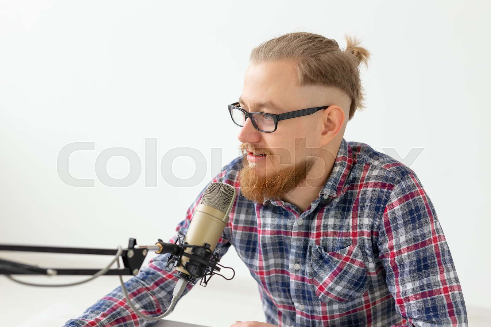 Radio host concept - Close-up of handsome man working as radio host at ...