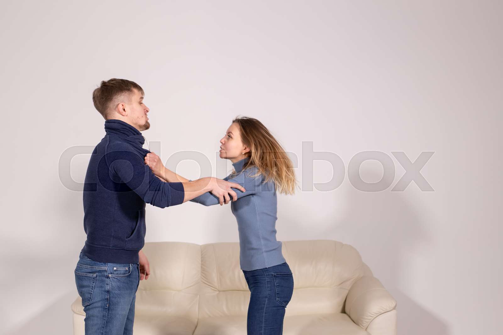 people, violence and abuse concept - young aggressive man hitting his ...