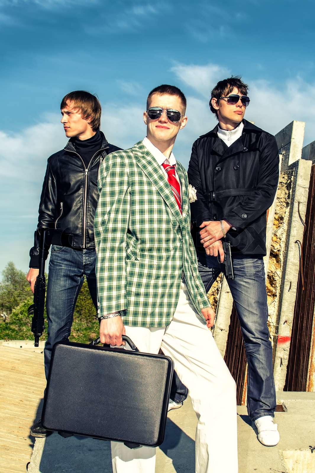 Mafia: Three thugs with a suitcase and weapons | Stock image | Colourbox