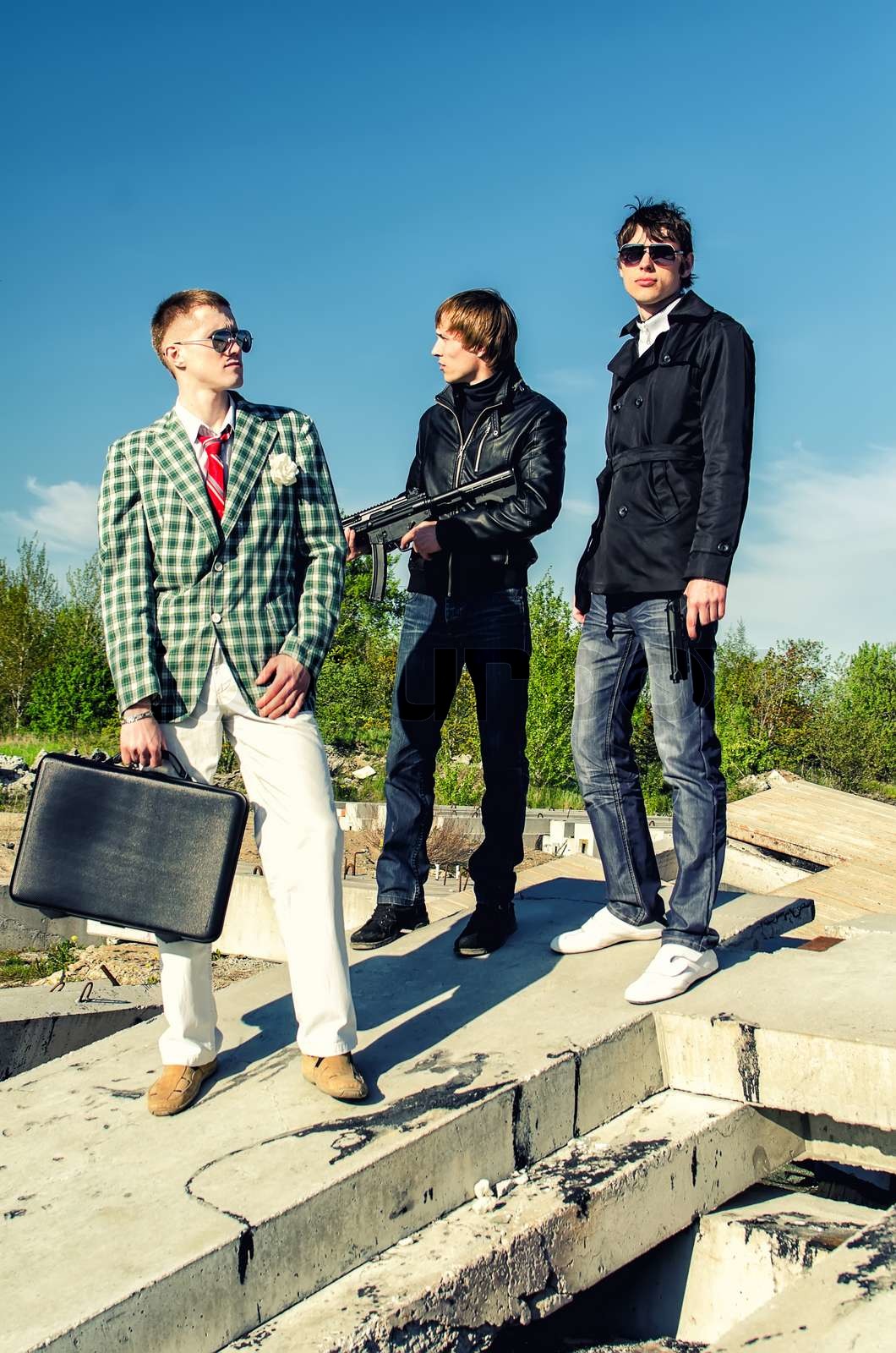 Mafia: Three thugs with a suitcase and weapons | Stock image | Colourbox