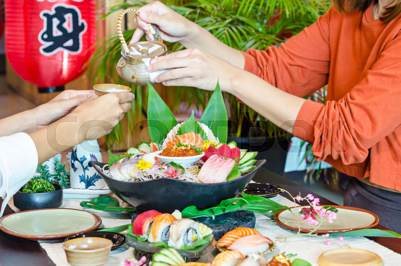 Two women eating sashimi Japanese. | Stock image | Colourbox