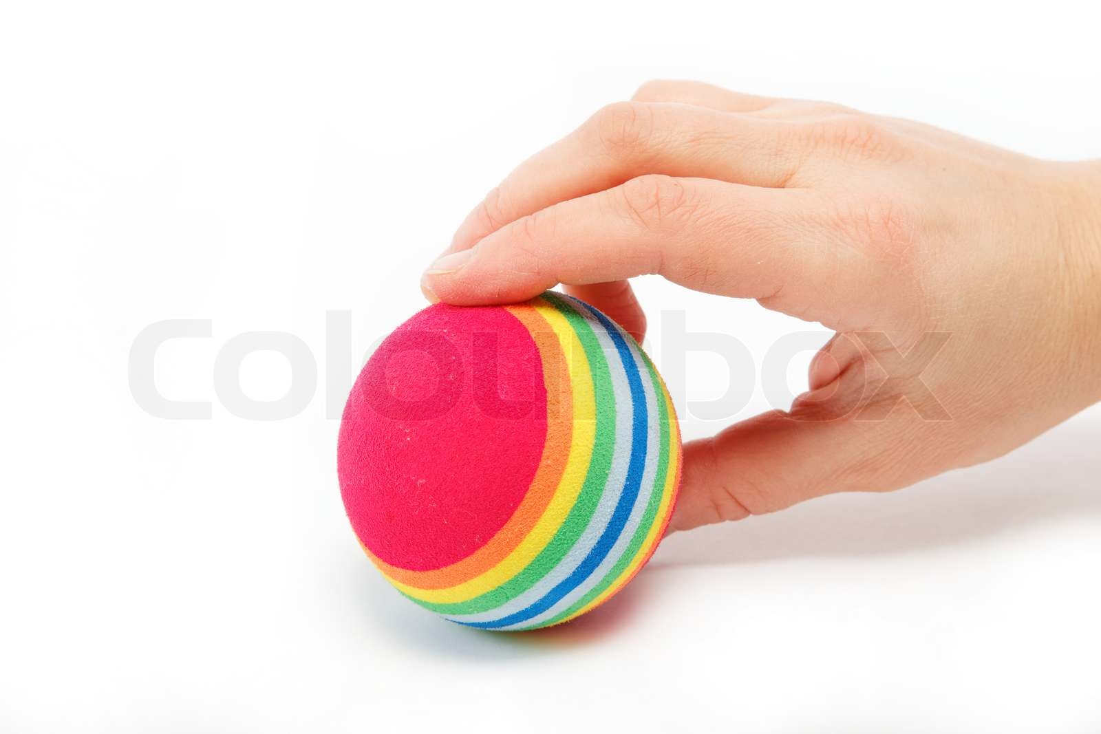 Ball in hand on a white background | Stock image | Colourbox