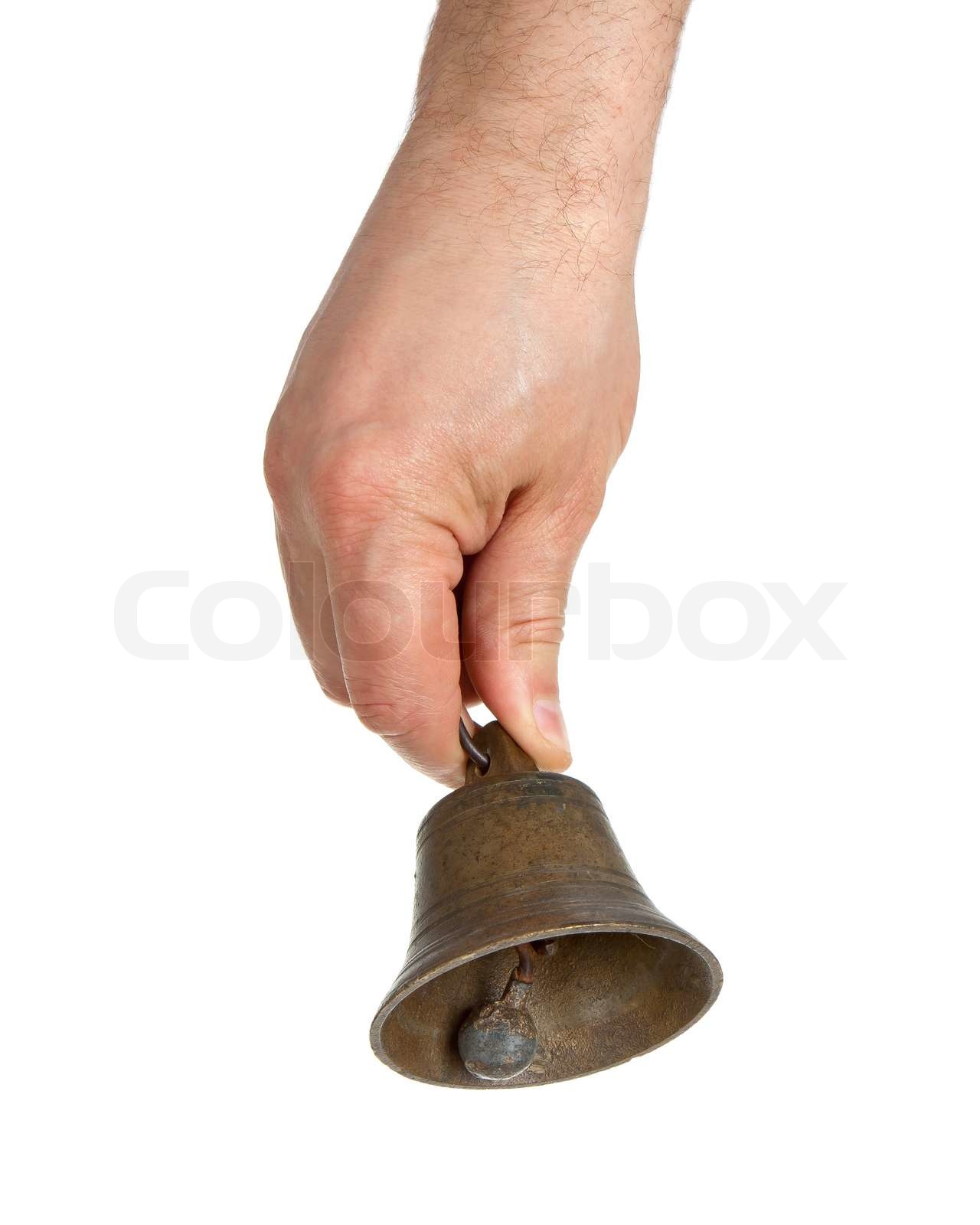 Hand holding bell | Stock image | Colourbox