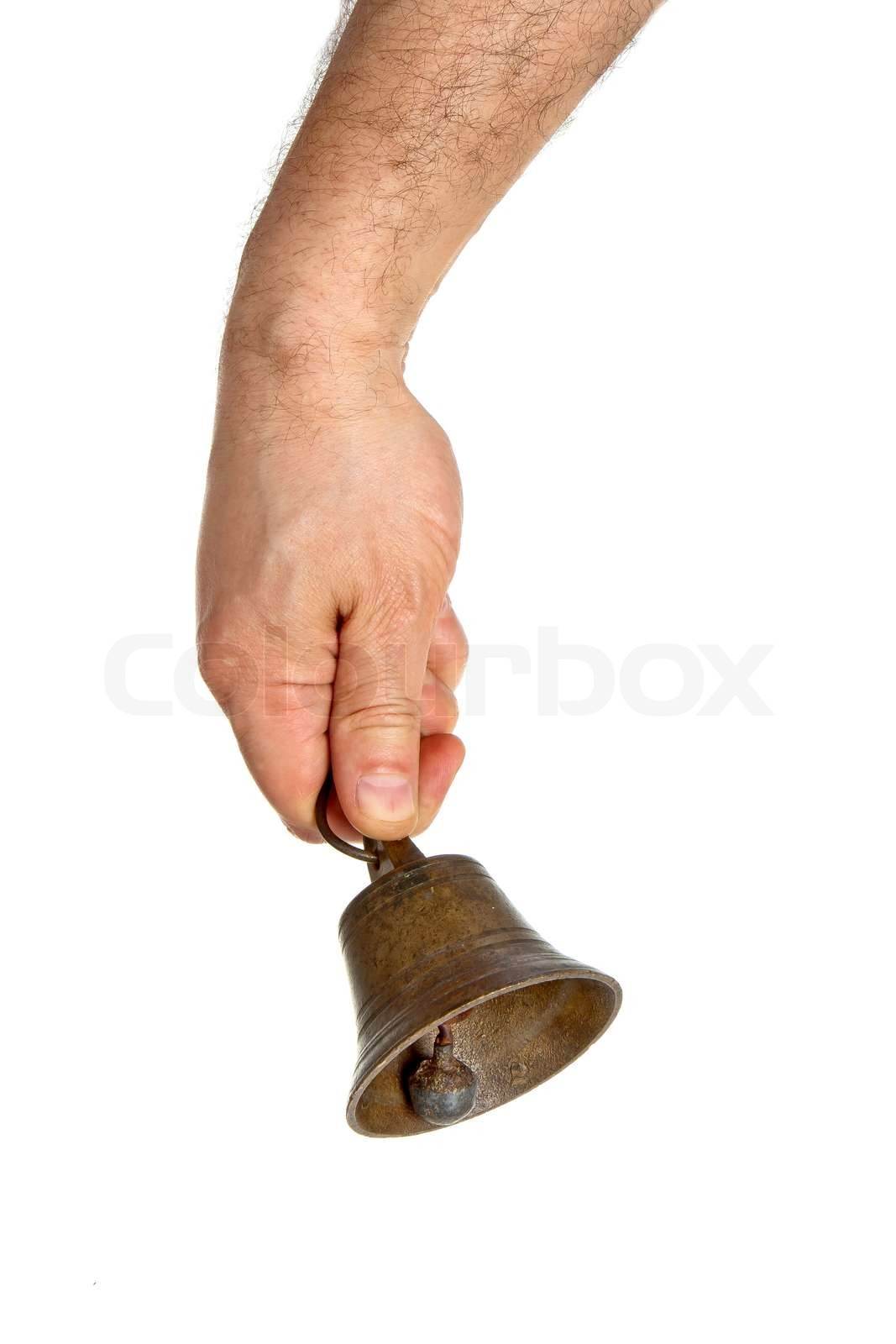 Hand holding bell | Stock image | Colourbox