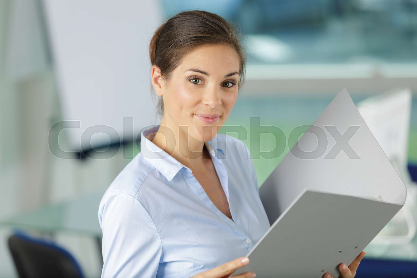 a happy office woman at work | Stock image | Colourbox