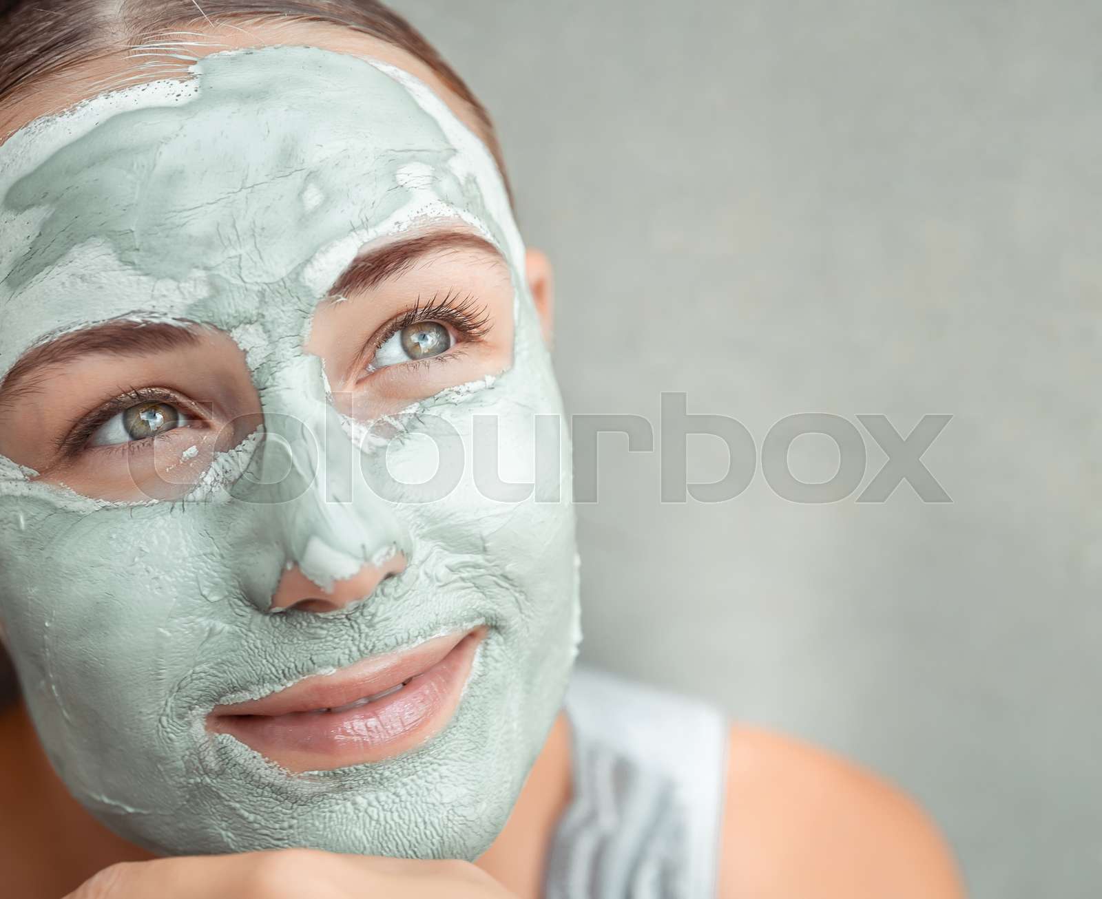 Beautiful girl doing facial mask | Stock image | Colourbox