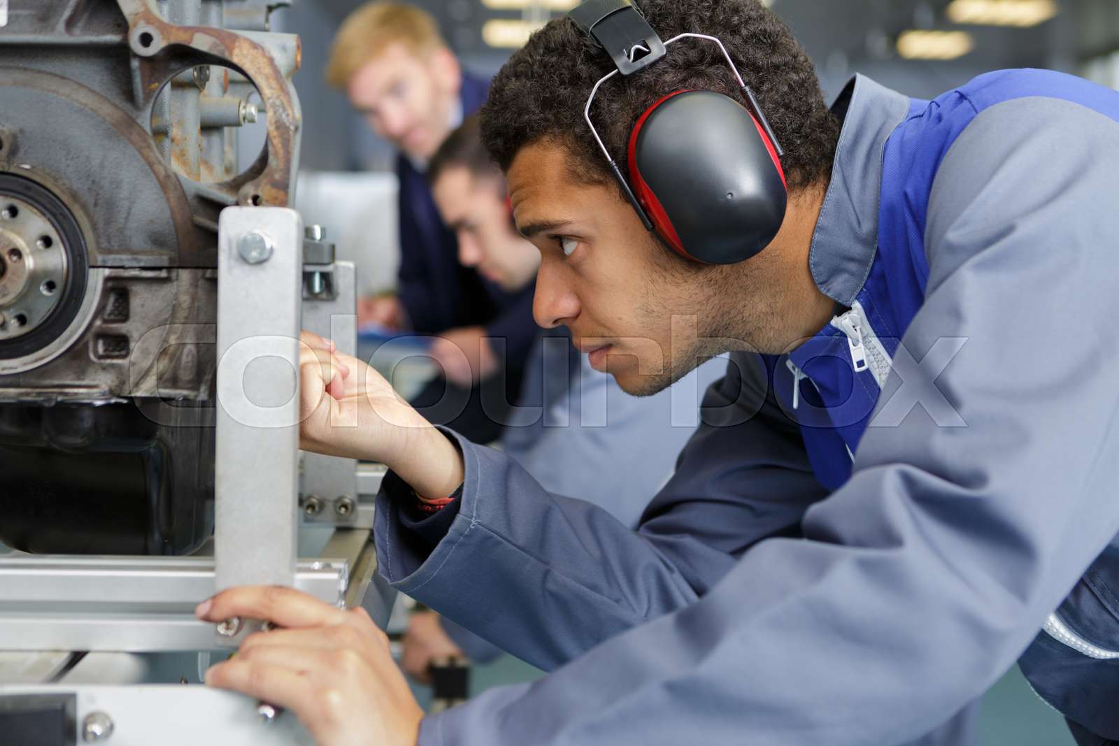close up mechanical man using tool | Stock image | Colourbox