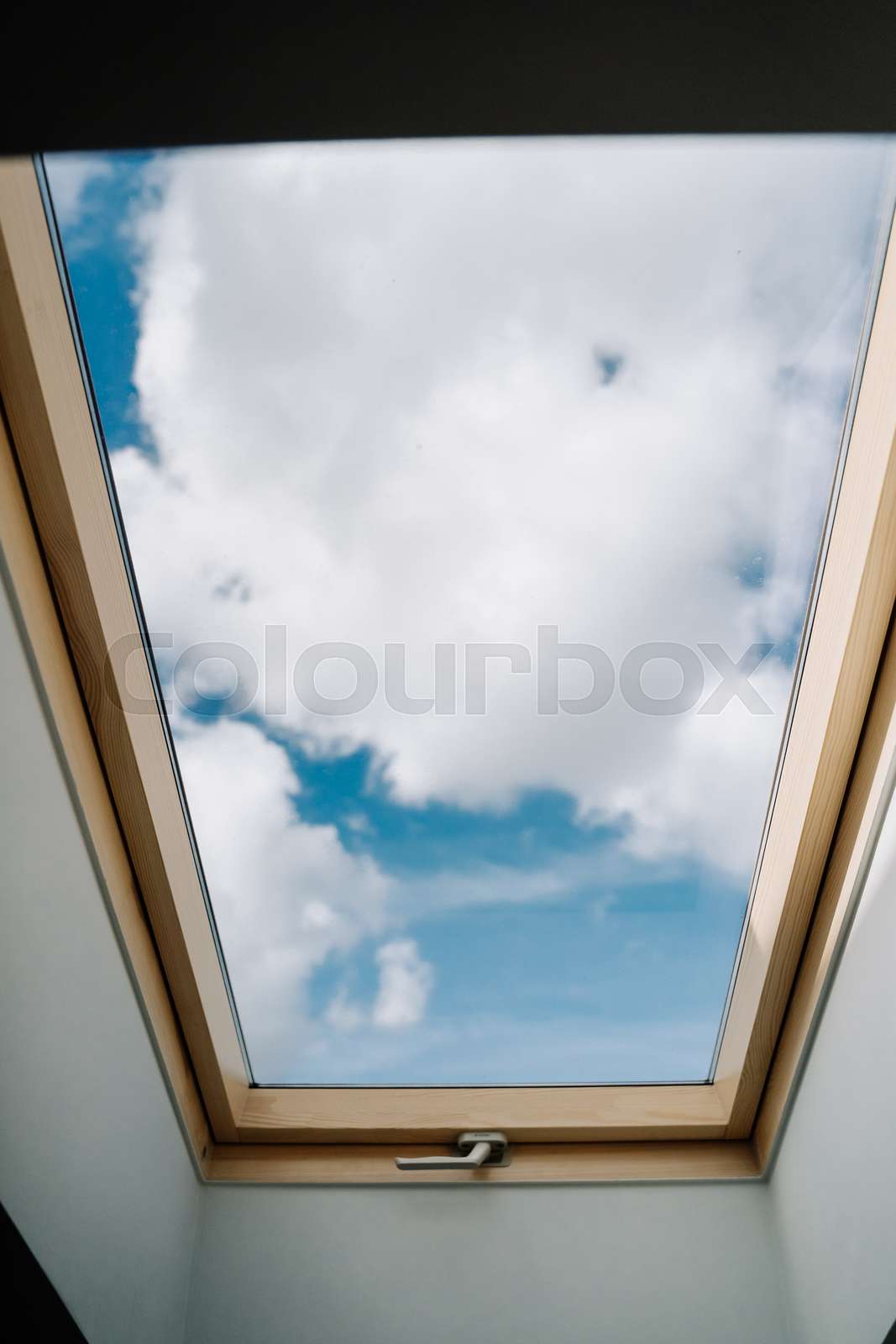 Roof Skylight Window and Blue Sky with Clouds | Stock image | Colourbox