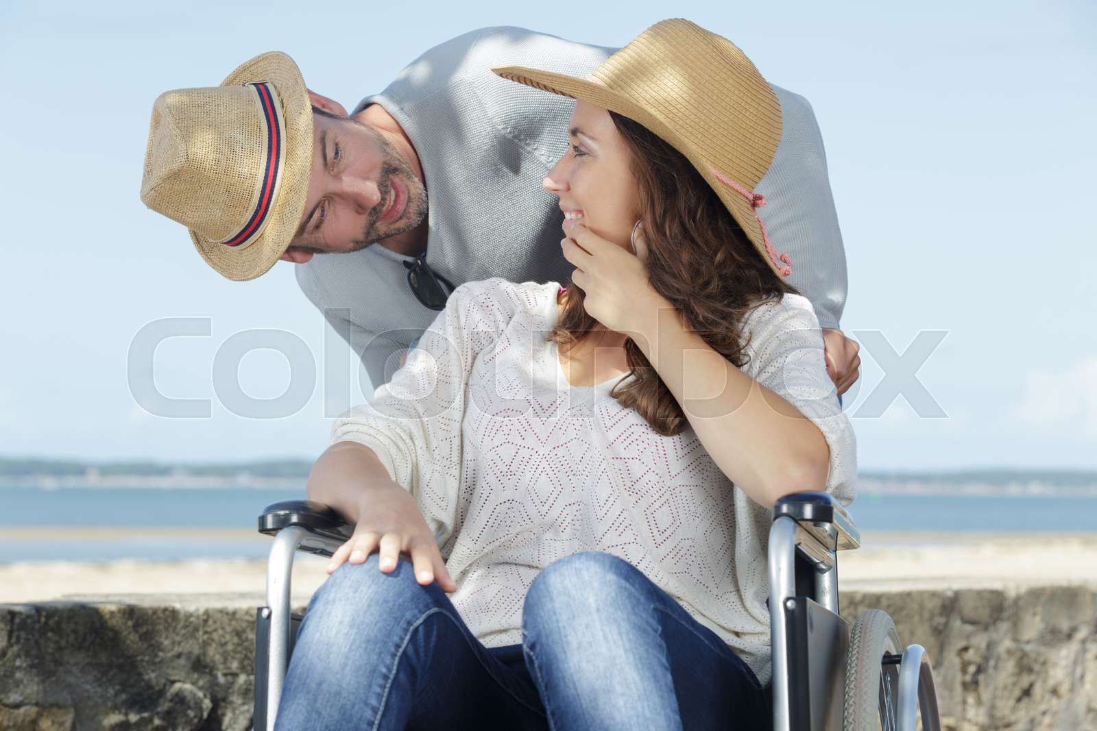 husband and paraplegic woman in wheelchair | Stock image | Colourbox
