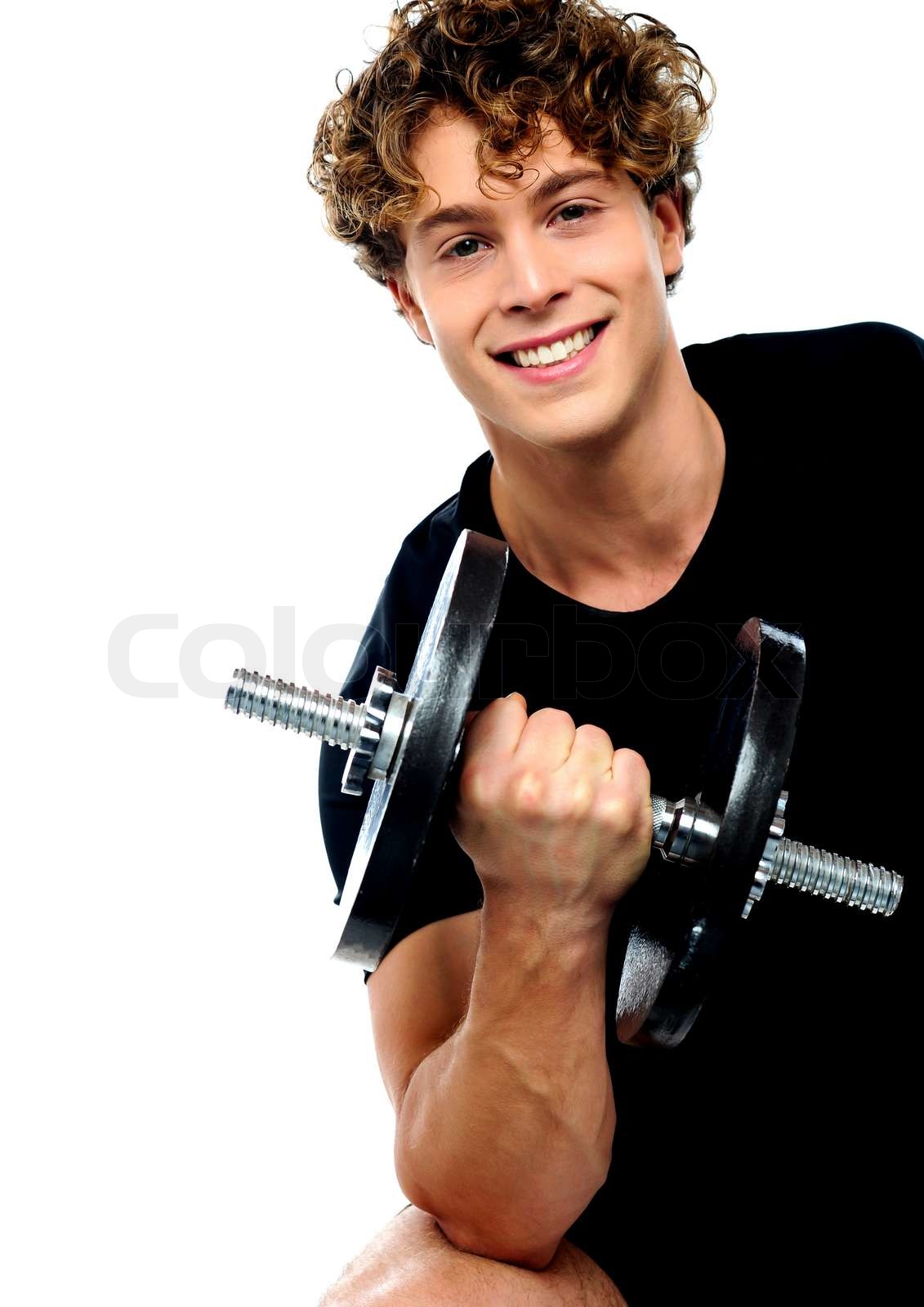 Athlete doing exercise with dumbbell | Stock image | Colourbox