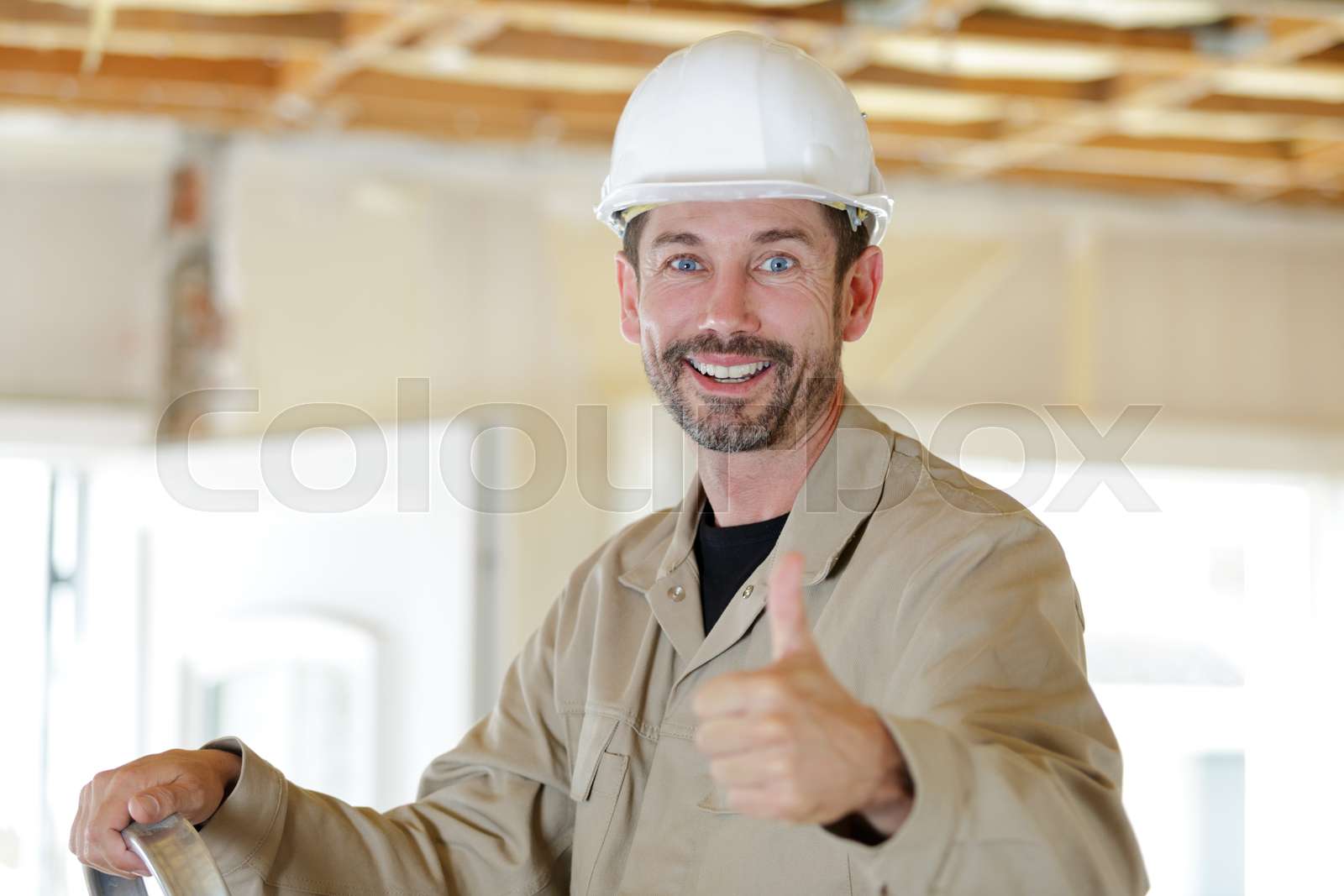 construction worker holding thumbs up | Stock image | Colourbox
