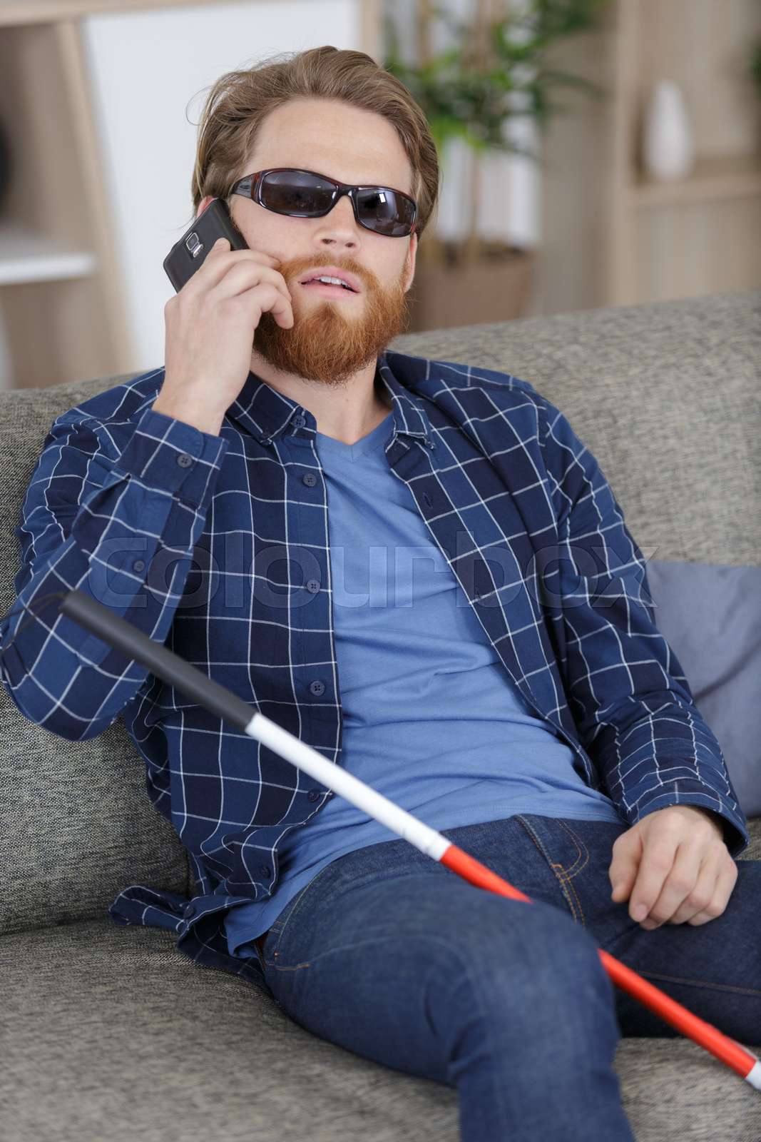 blind man with disability using digital assistant on mobile phone ...