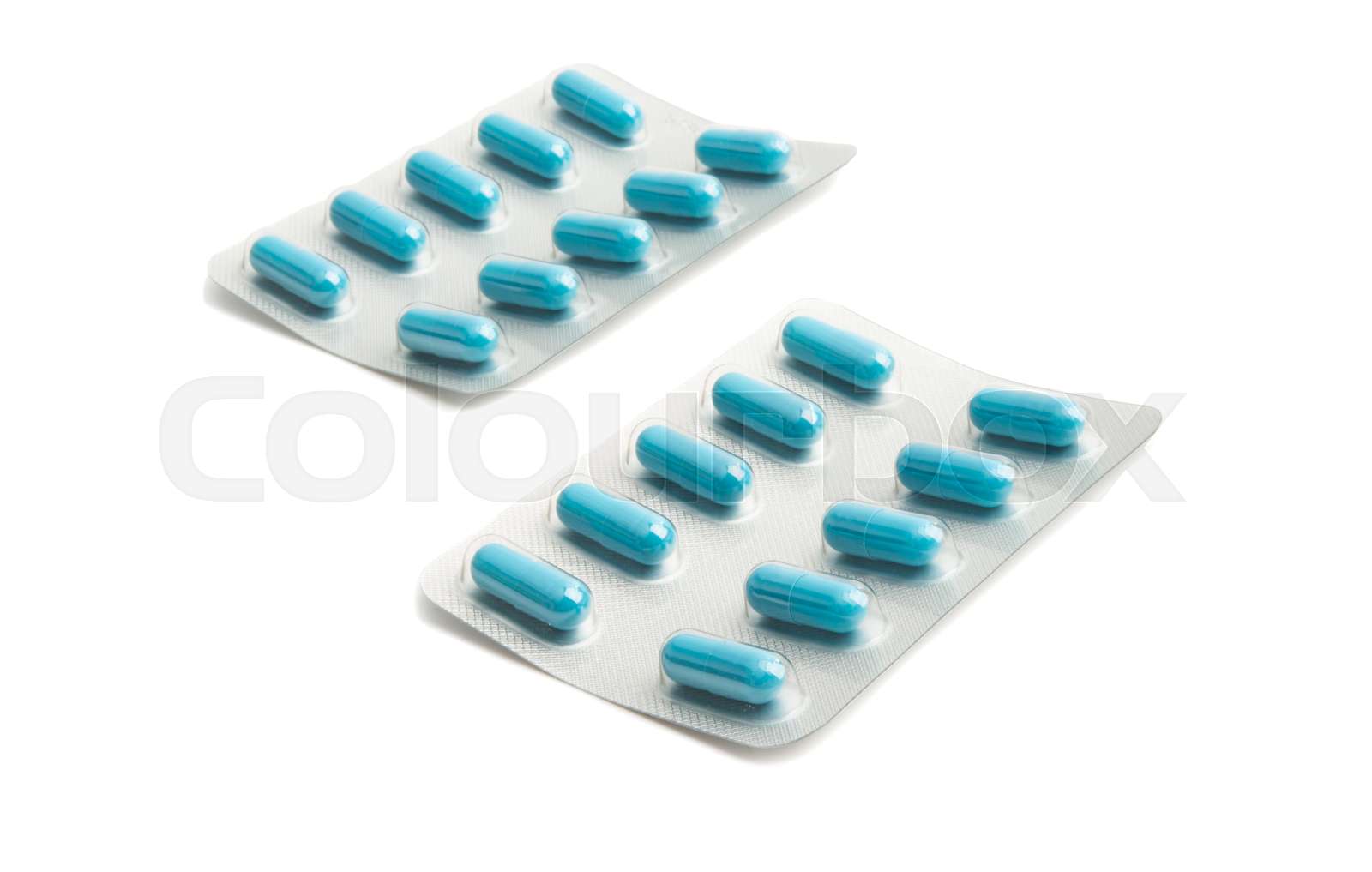 pack of blue capsules isolated | Stock image | Colourbox